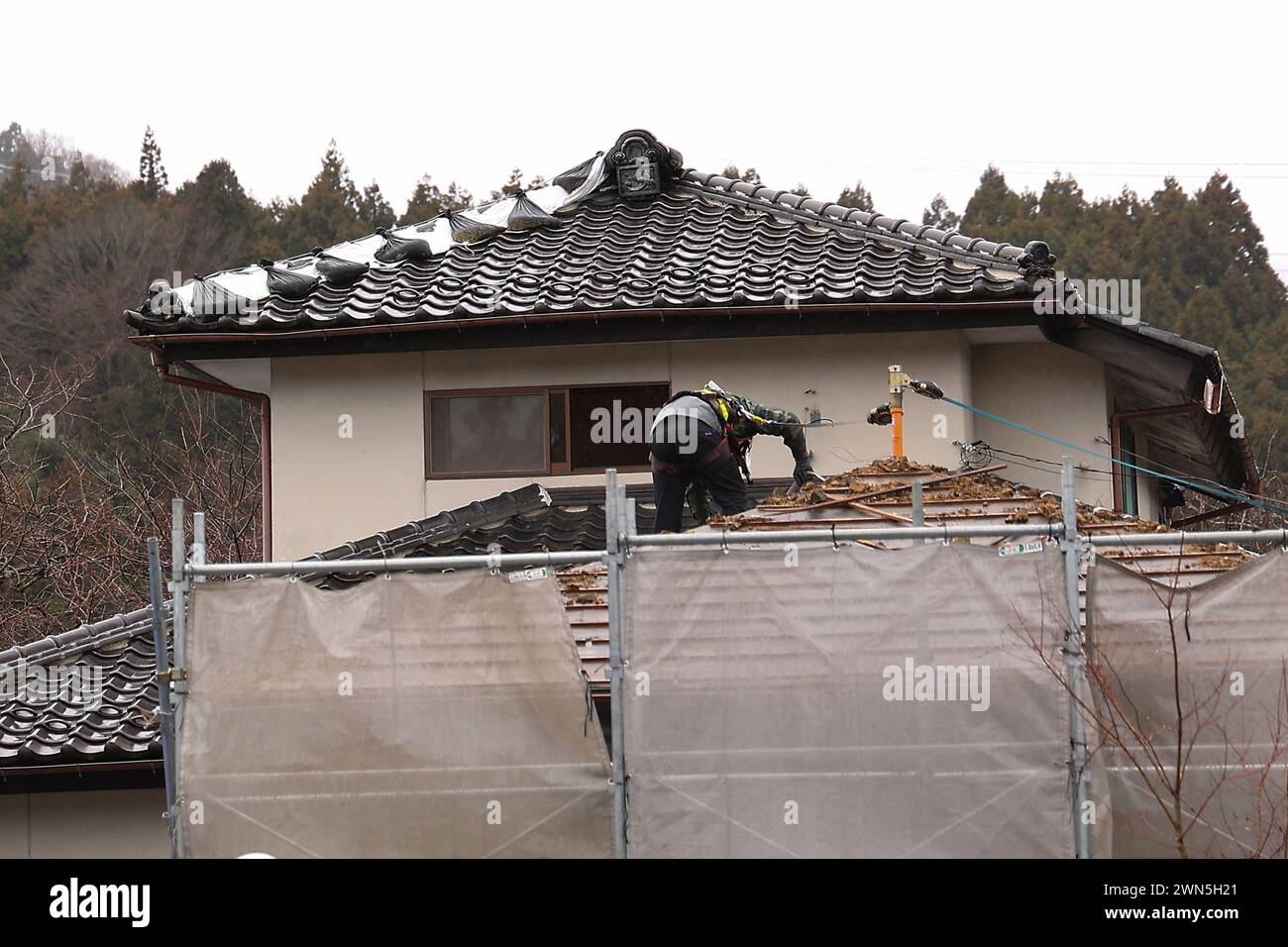 Namie, Fukushima, Japan. 27th Feb, 2024. Construction workers demolish ...