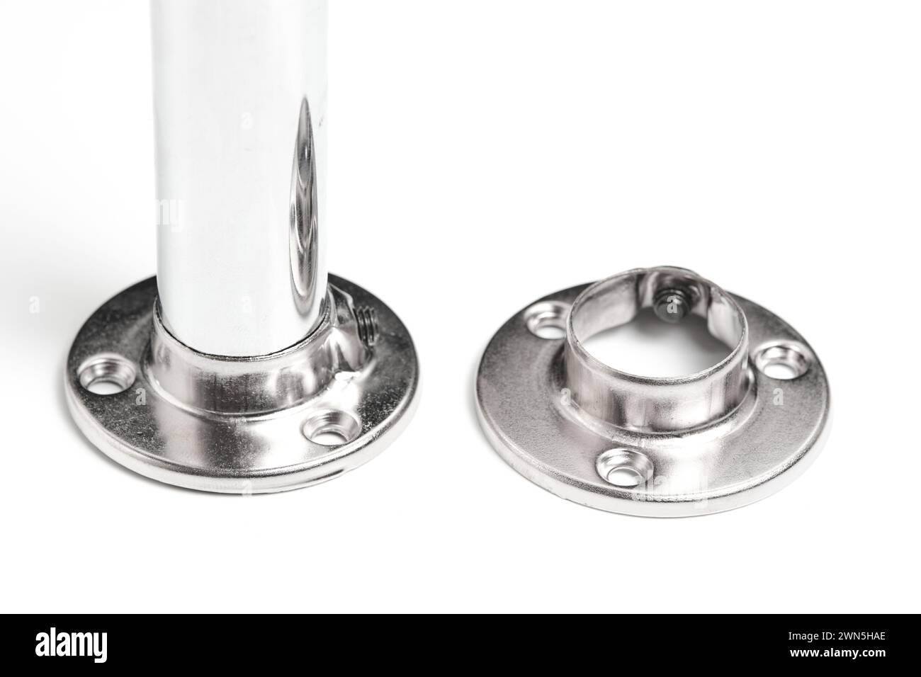 Nickel plated tube and two flanges for its attachment, white background ...
