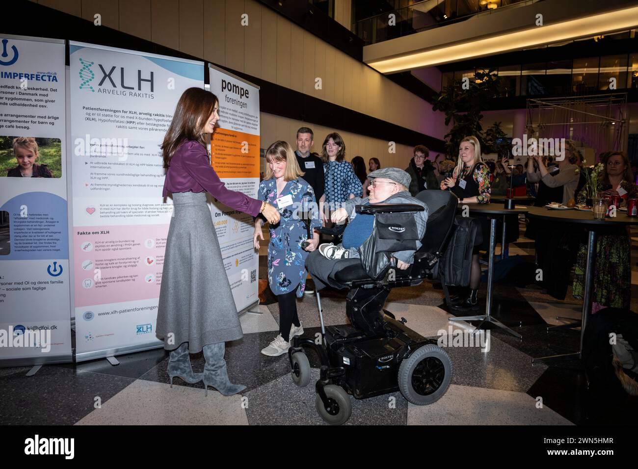 Danish Queen Mary speaks to Karsten Jensen from the Danish Association ...