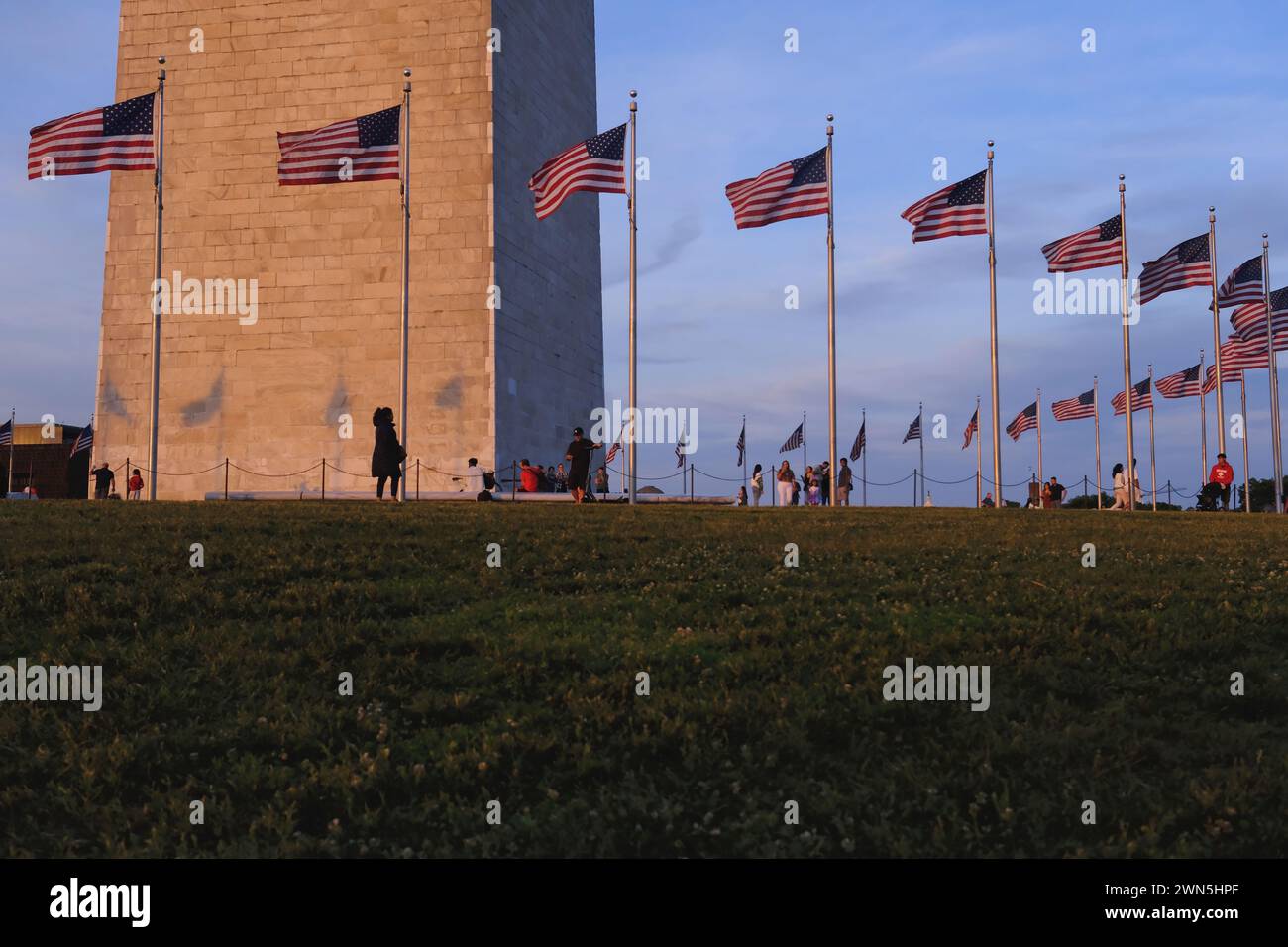 The Washington Monument surrounded by US flags in National Mall ...