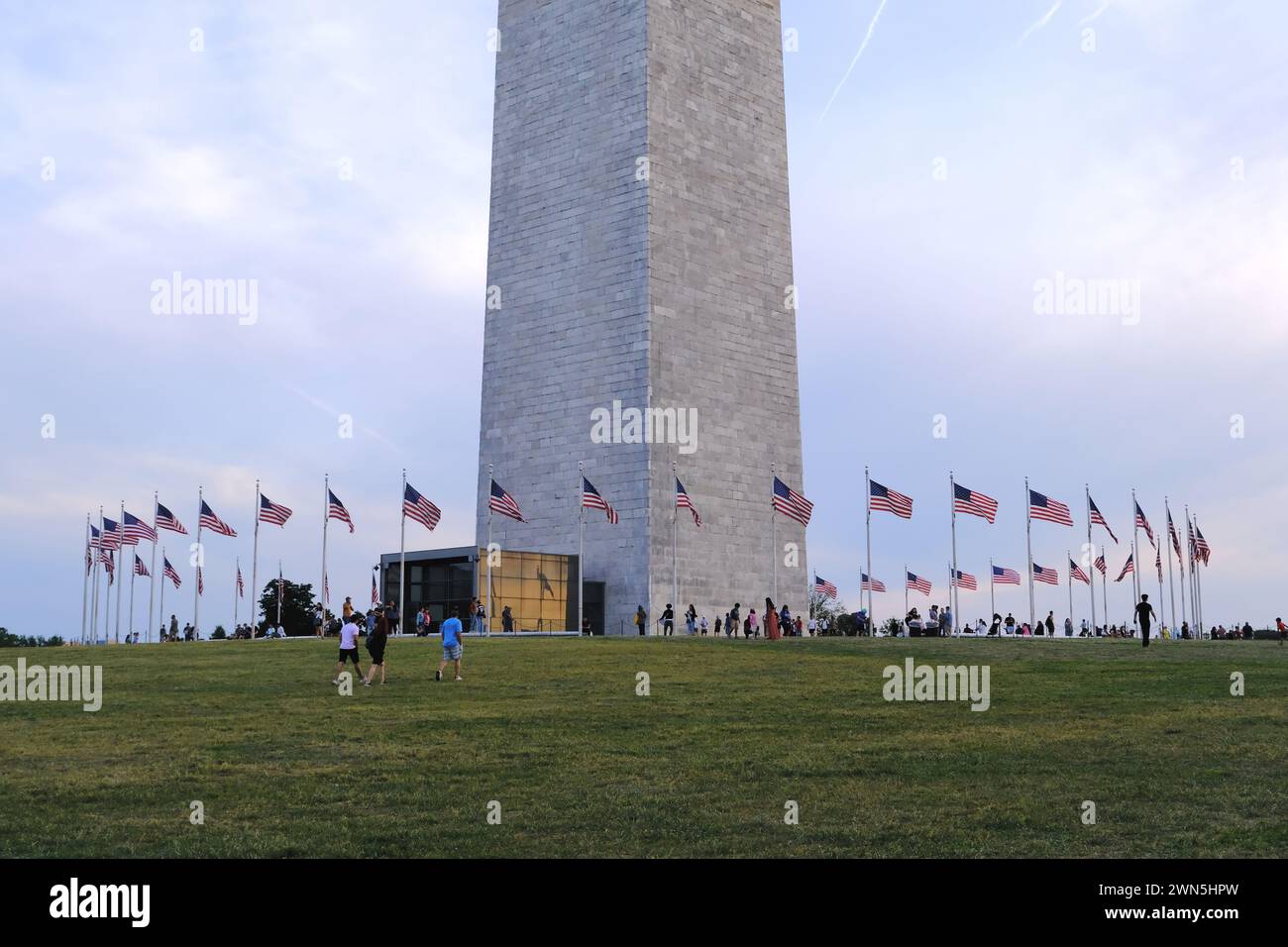 The Washington Monument surrounded by US flags in National Mall ...