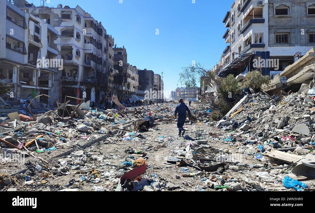 People inspect damage and recover items from their homes following ...