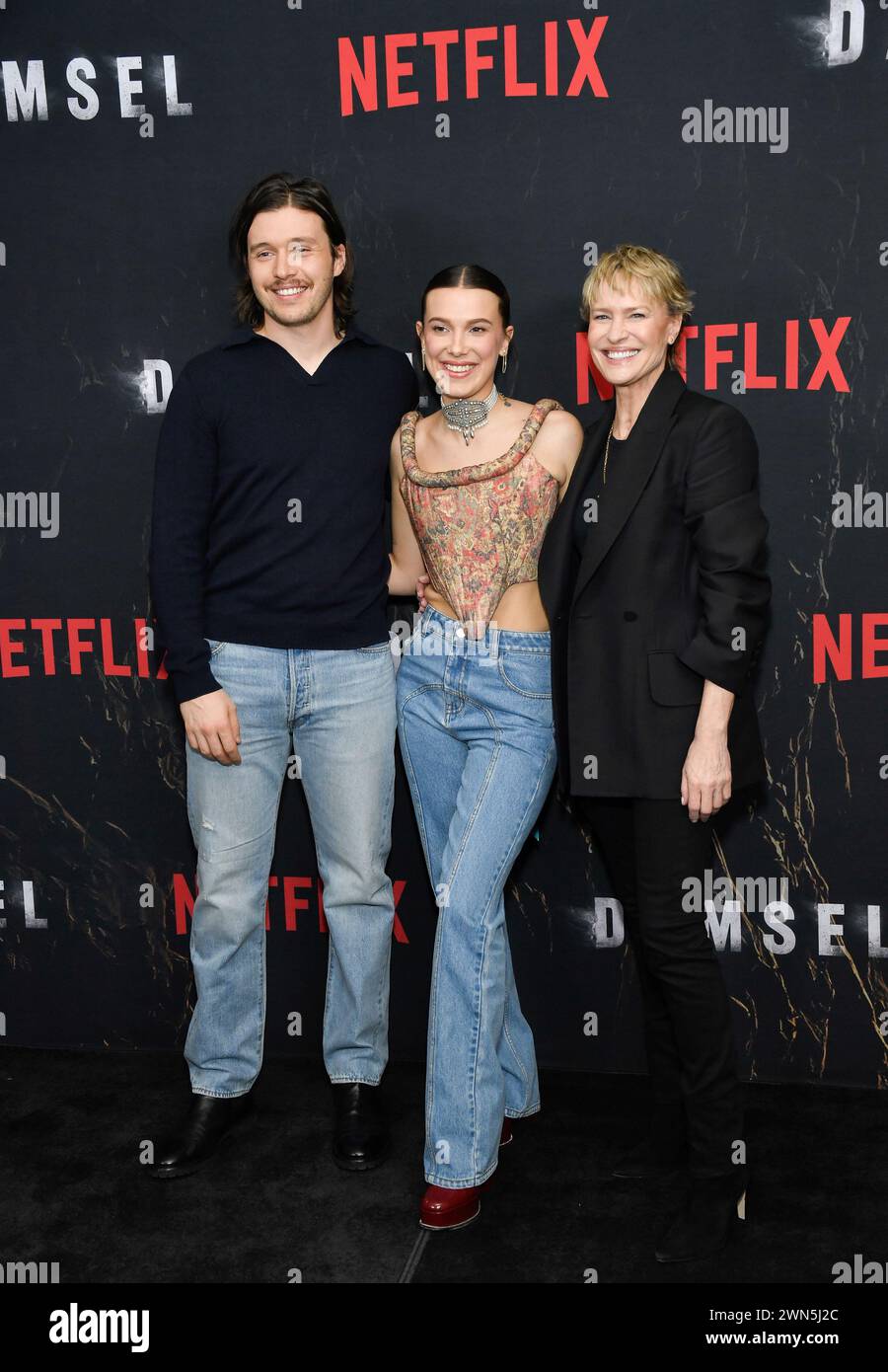 Actors Nick Robinson, left, Millie Bobby Brown and Robin Wright pose ...