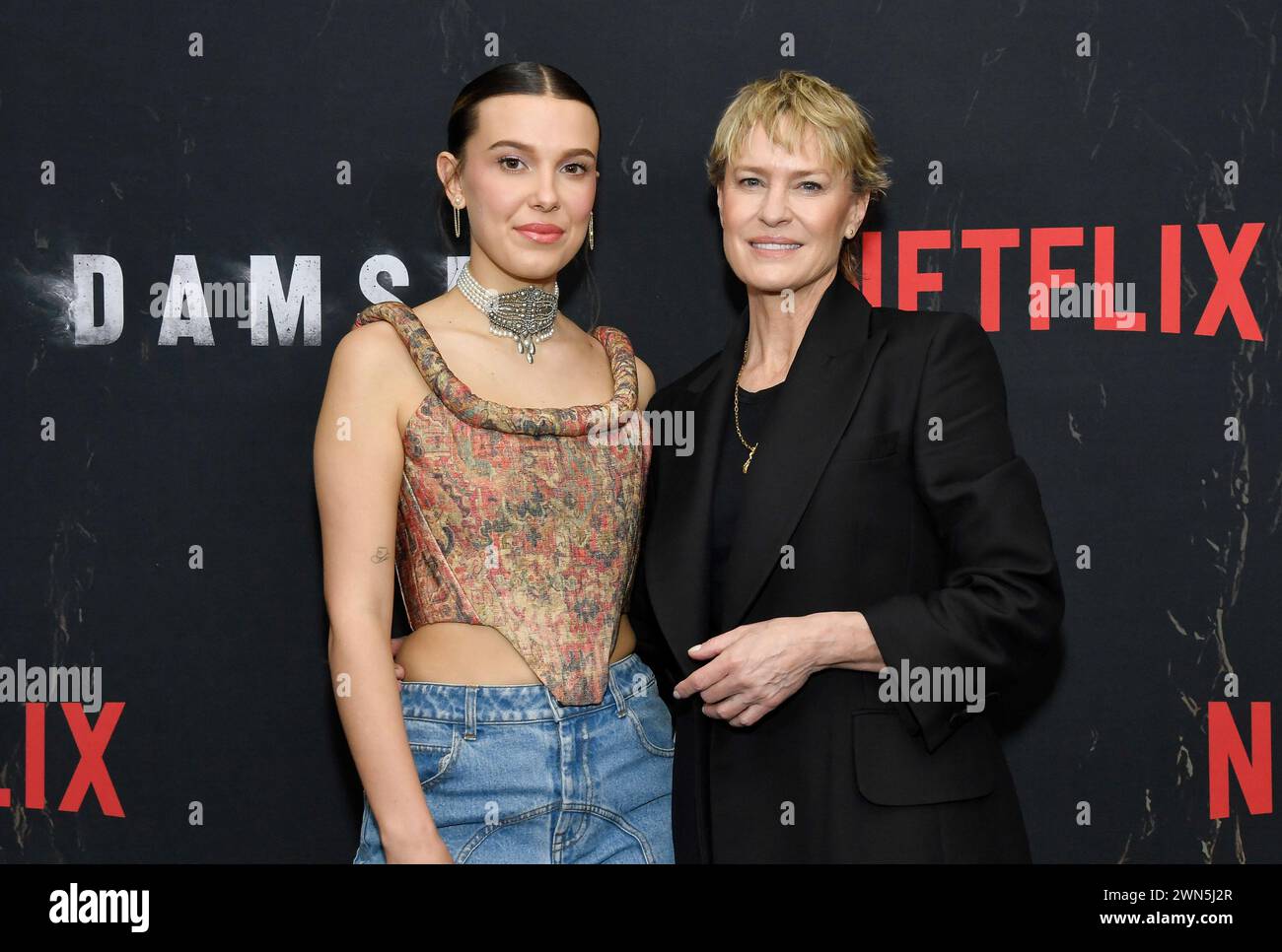 Actors Millie Bobby Brown, left, and Robin Wright pose together at the ...