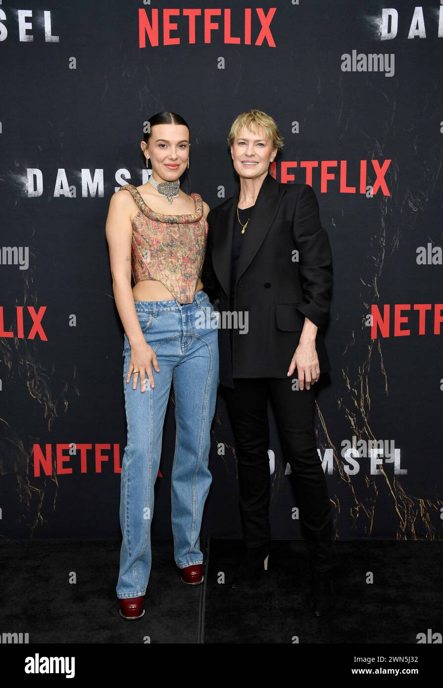 Actors Millie Bobby Brown, left, and Robin Wright pose together at the ...