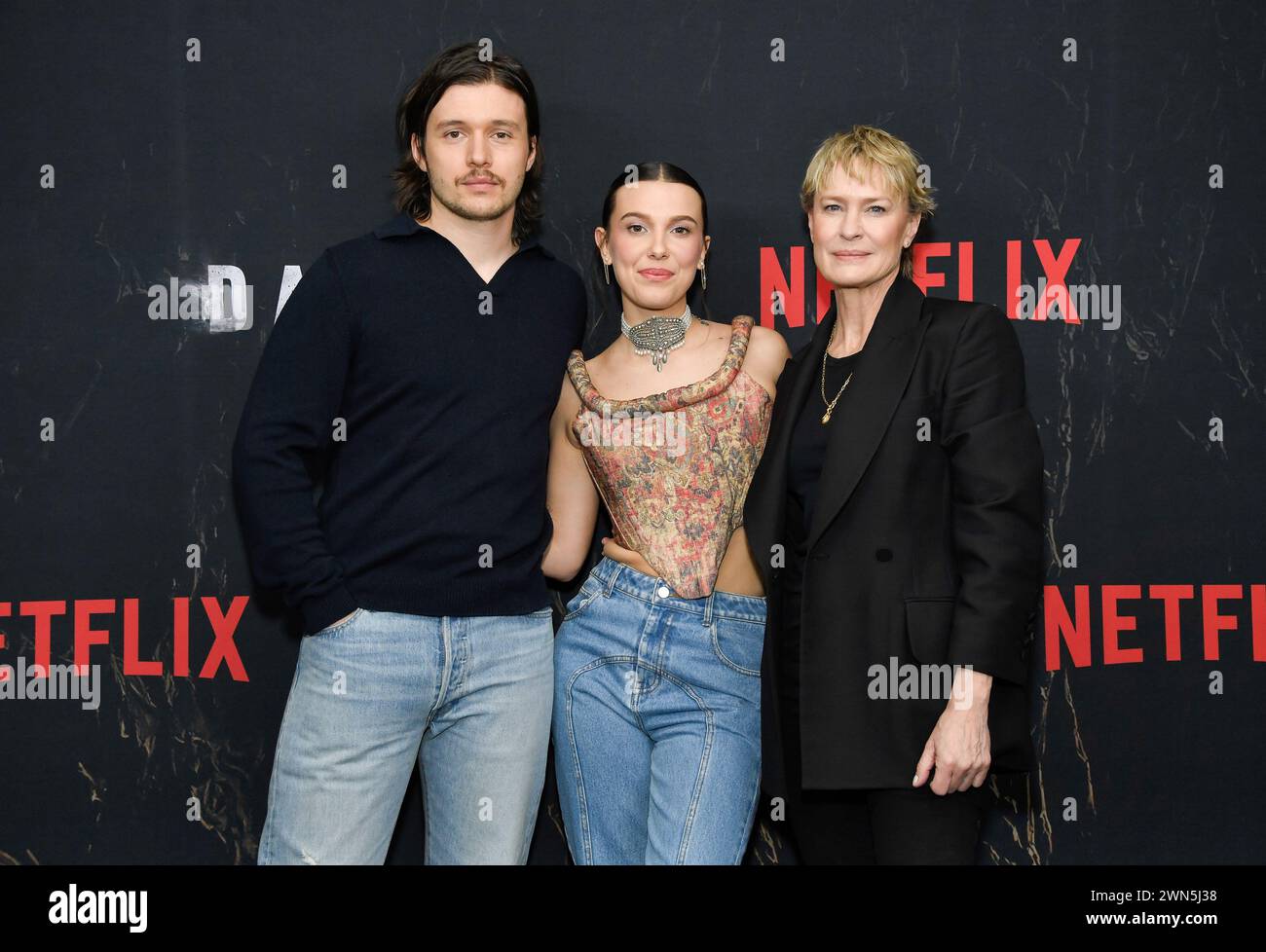 Actors Nick Robinson, left, Millie Bobby Brown and Robin Wright pose ...