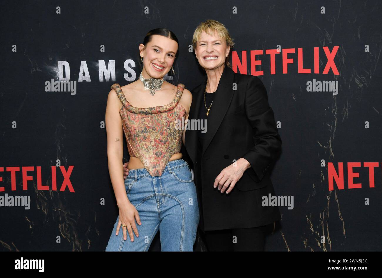 Actors Millie Bobby Brown, left, and Robin Wright pose together at the ...
