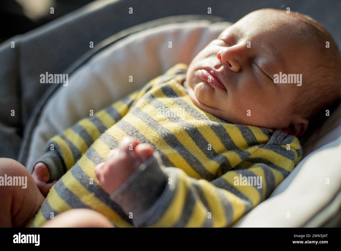 Newborn baby sleeps restlessly, colic in children Stock Photo - Alamy