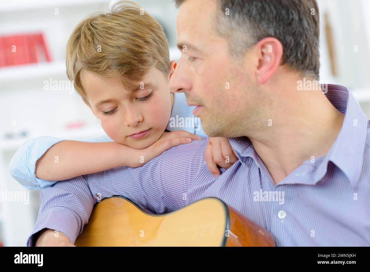 Child touching shoulder hi-res stock photography and images - Alamy
