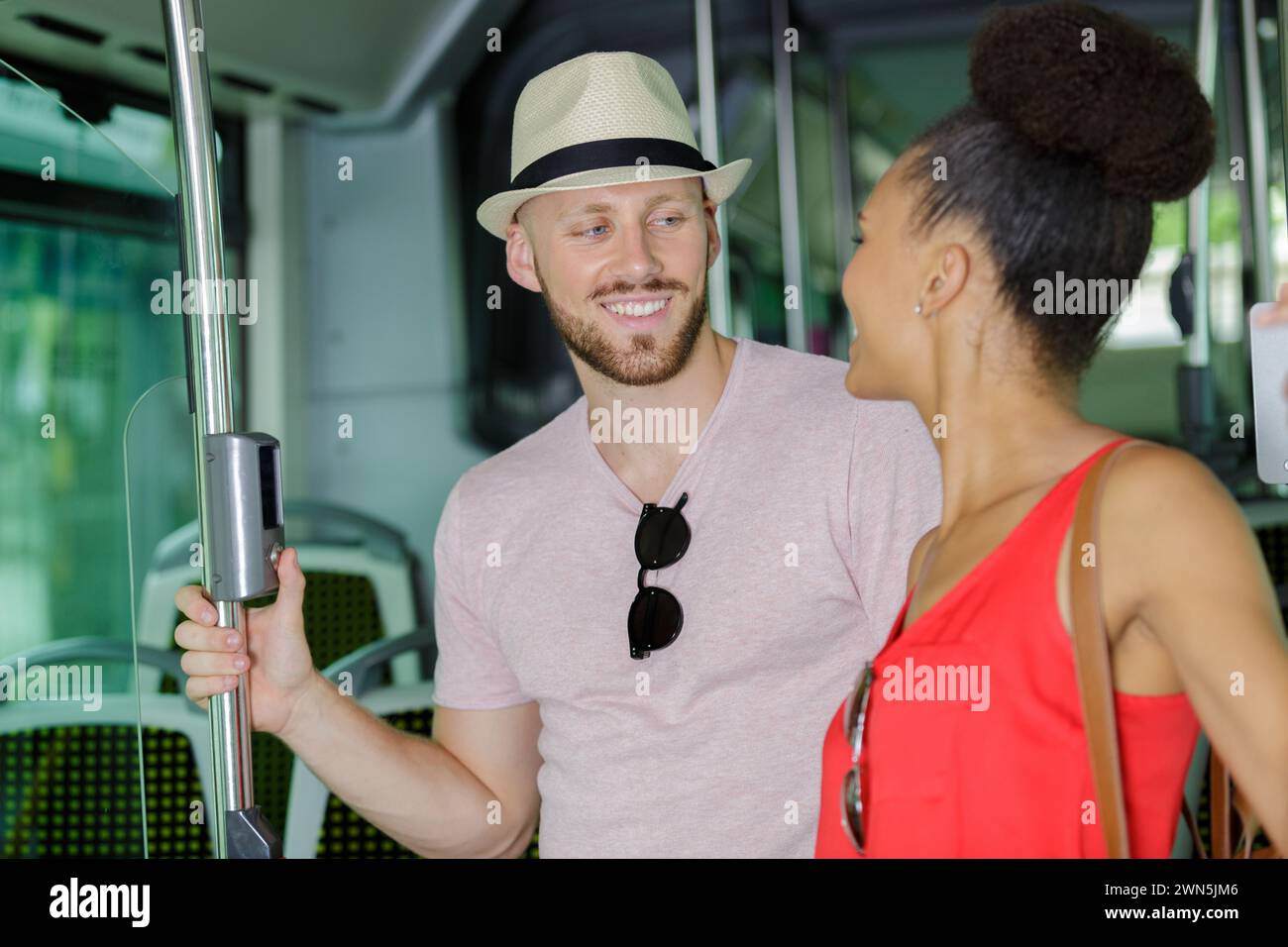 couple standing in a city bus Stock Photo - Alamy
