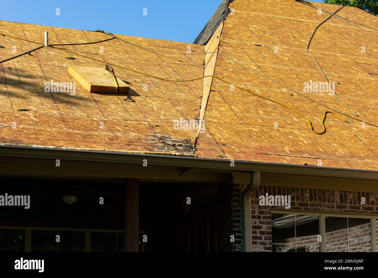 House getting a replacement shingle roof Stock Photo - Alamy