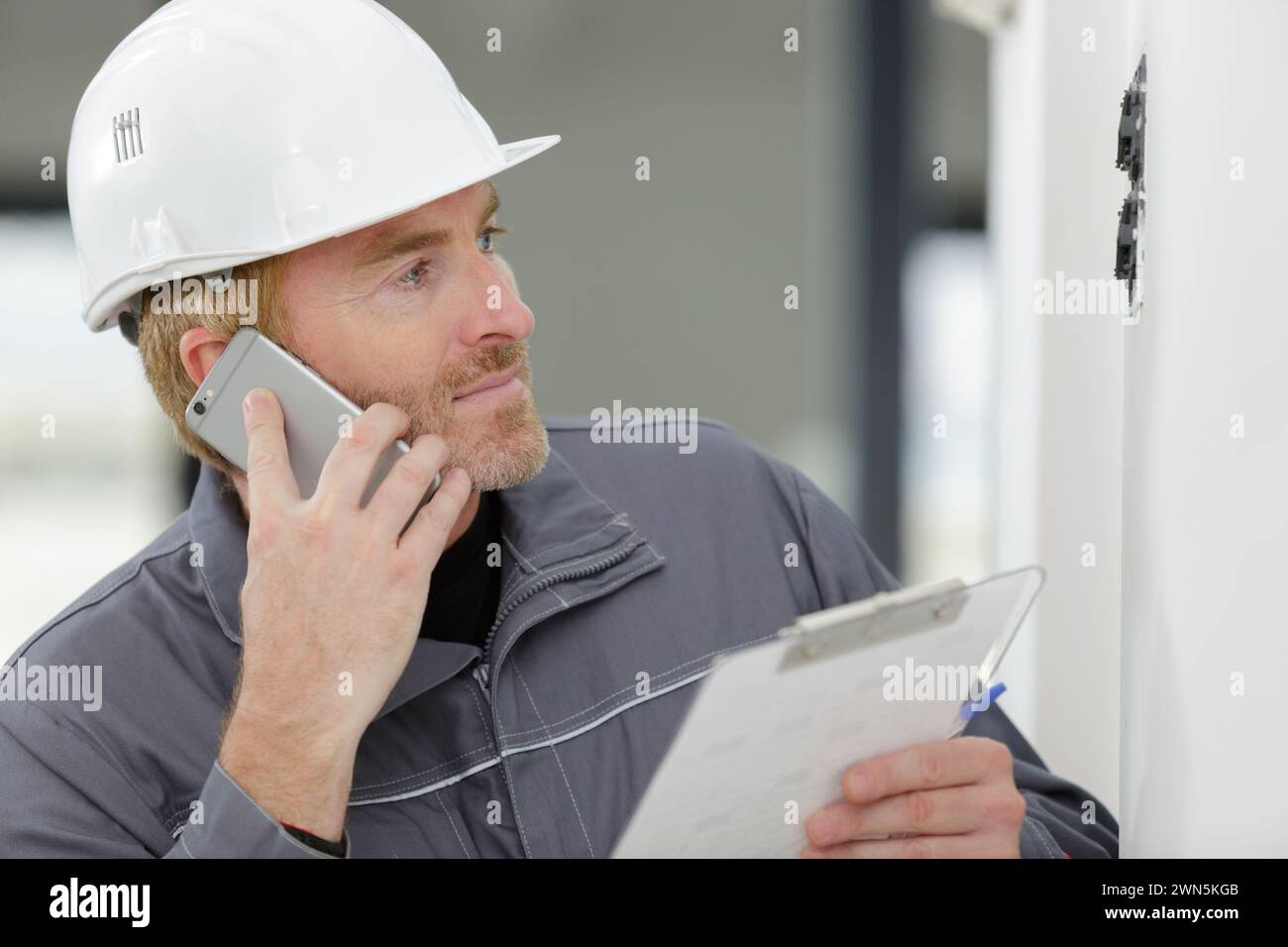 building safety inspector calling maintenance team electrical damage ...