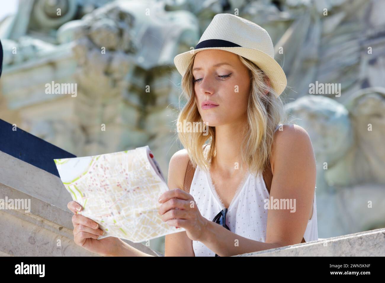 female tourist studying her map Stock Photo - Alamy