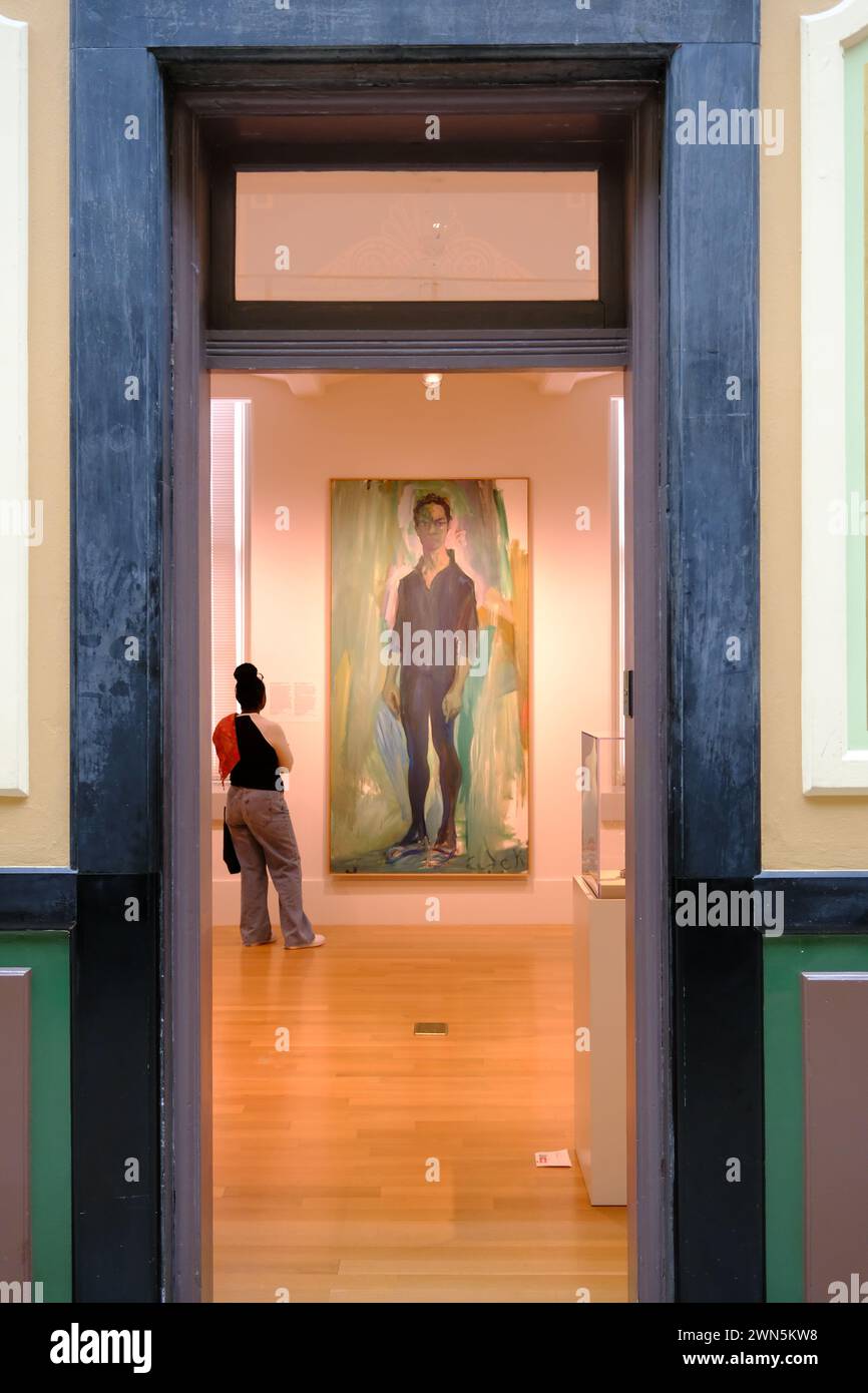 The view of a visitor admiring a painting inside of National Portrait ...