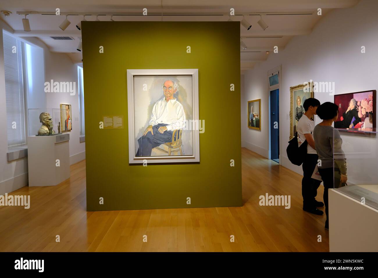 Visitors inside of National Portrait Gallery with the painting of Linus ...