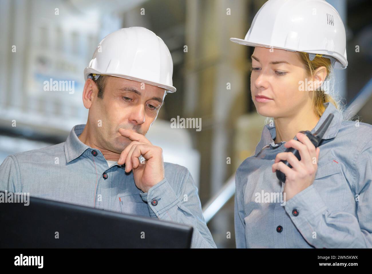 female factory worker and her manager Stock Photo - Alamy