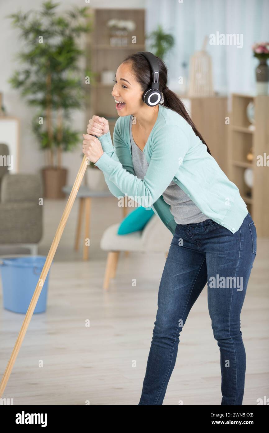 a beautiful cheerful hardworking lady singing Stock Photo - Alamy