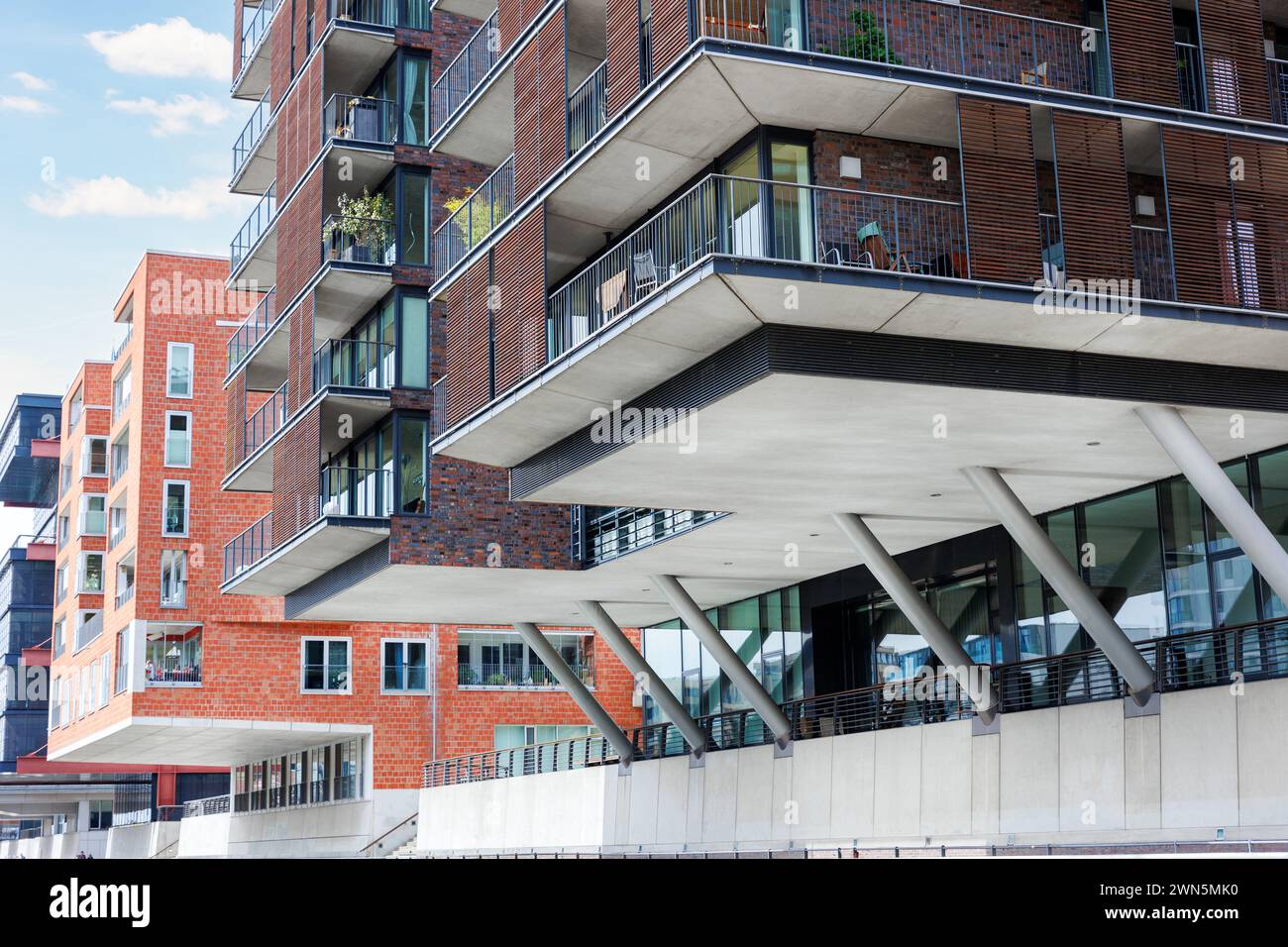 Contemporary Residential Building brick facade houses on stilts metal ...