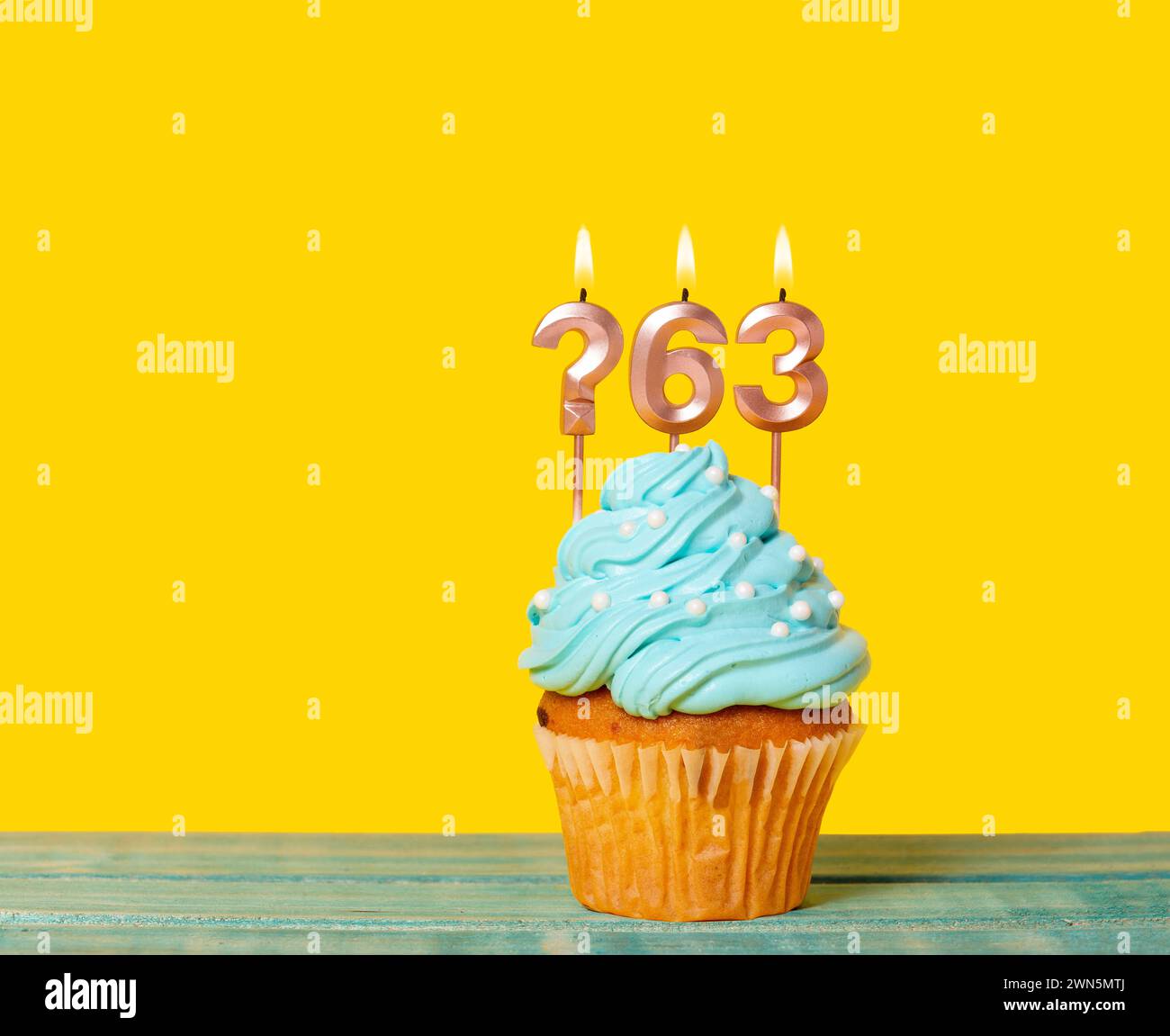 Birthday Cake With Candle Question Mark And Number 63 - On Yellow ...