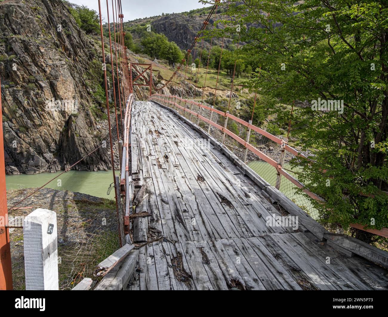 Old-style suspension bridge over Rio Mayer, on road X-905 from Villa o ...