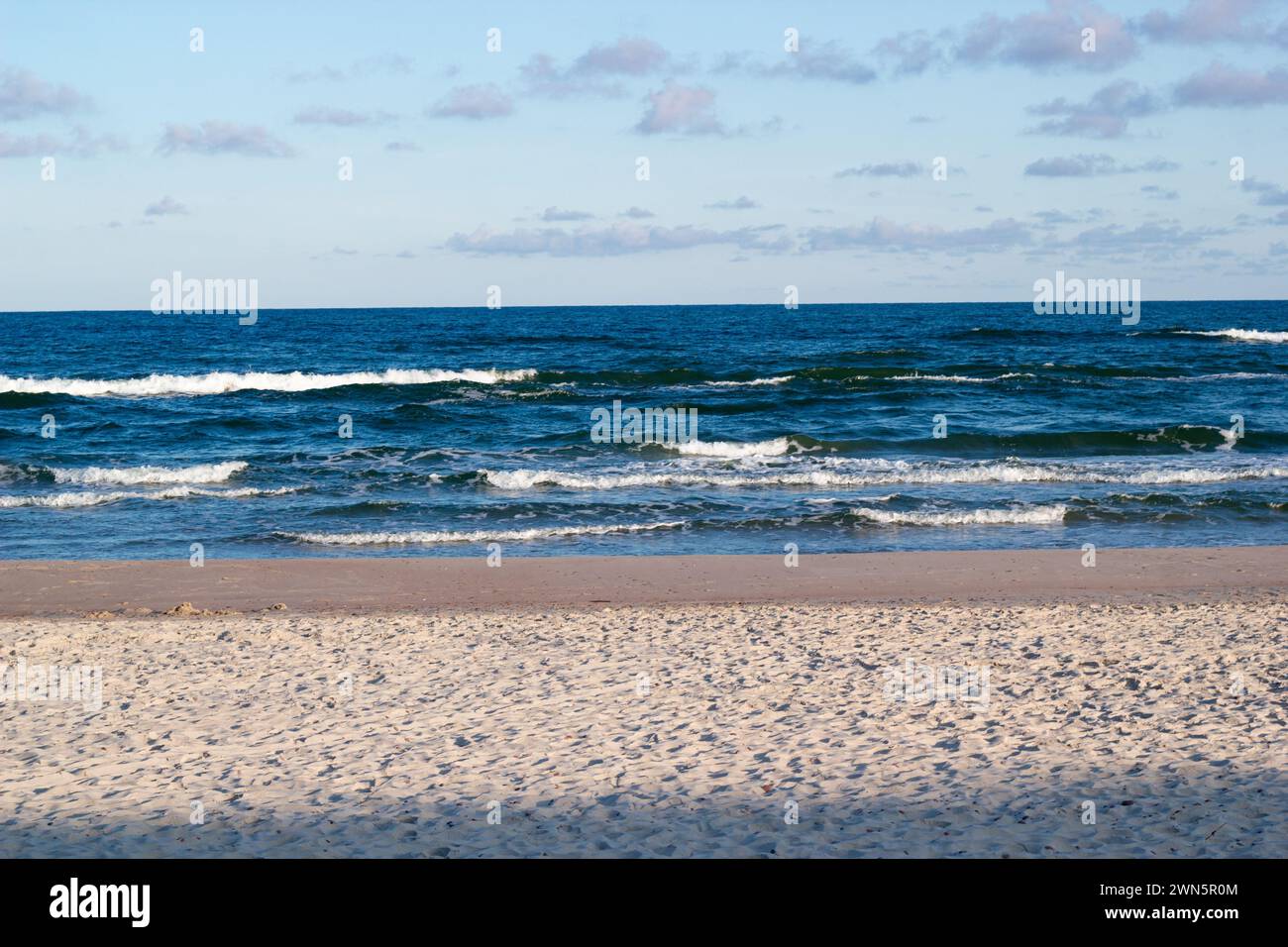 Beach with sea and sand Stock Photo - Alamy