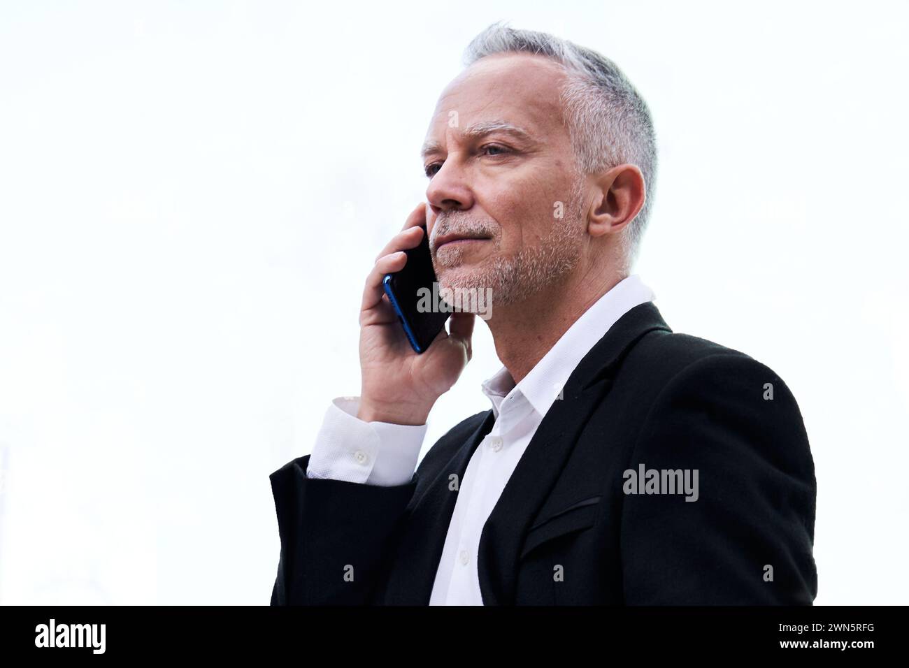 Handsome successful businessman using hi-res stock photography and ...