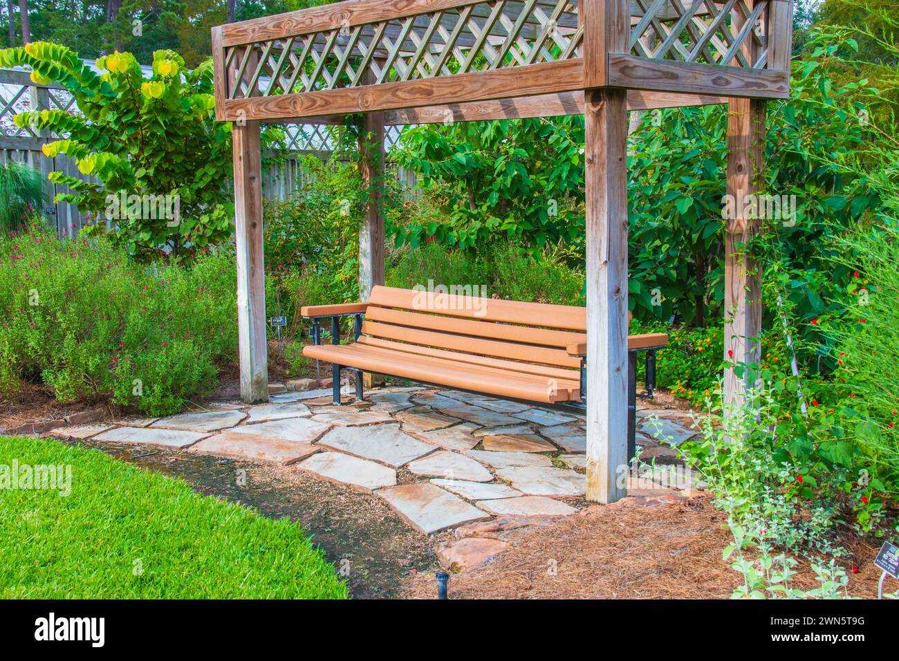 Garden scene with bench in Mercer Arboretum and Botanical Garden in ...