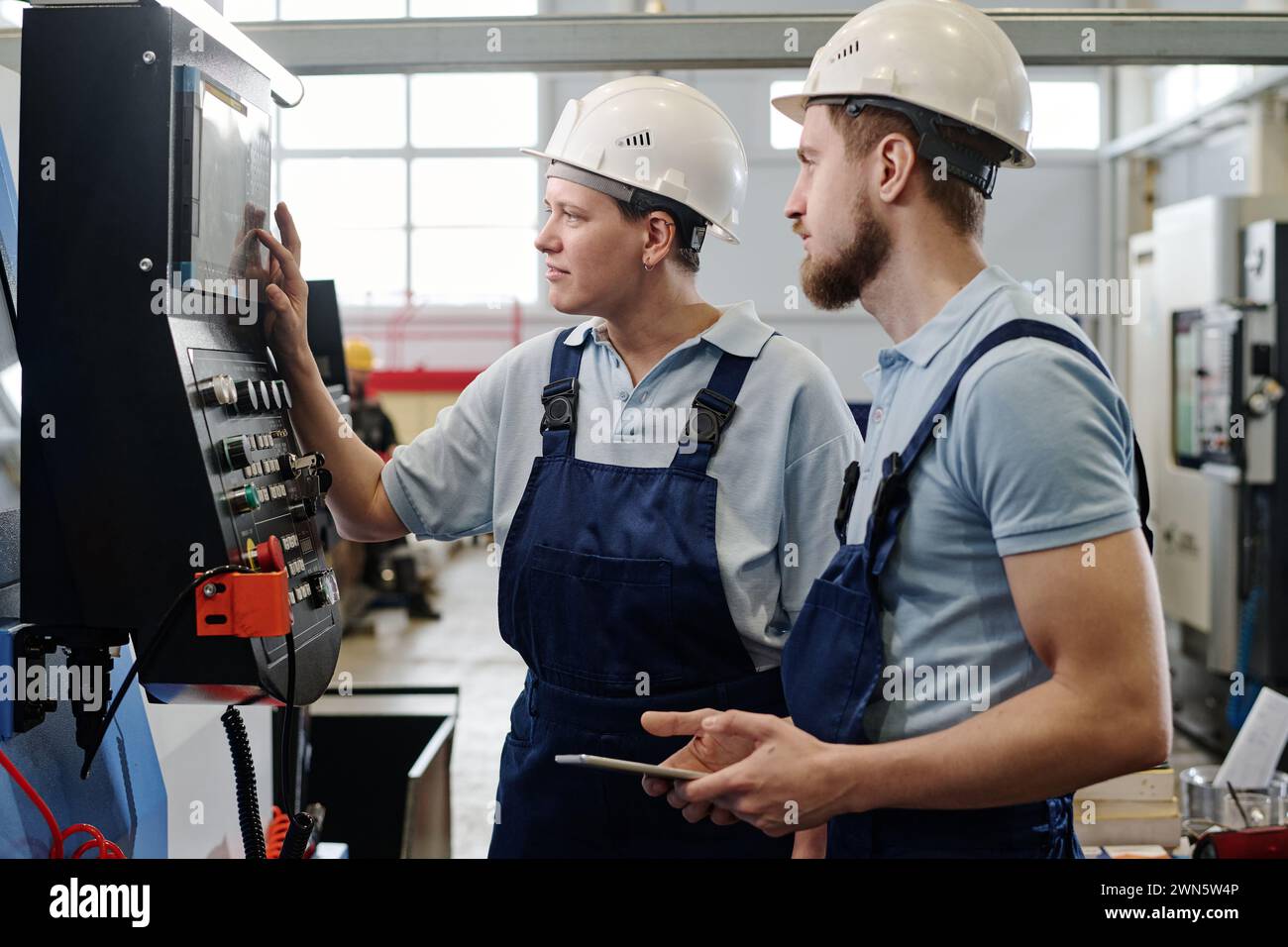 Man wearing workwear operate hi-res stock photography and images - Alamy
