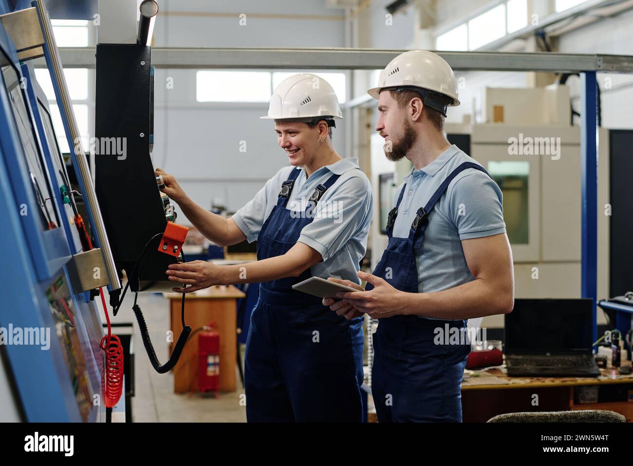 Young technician in uniform hi-res stock photography and images - Alamy