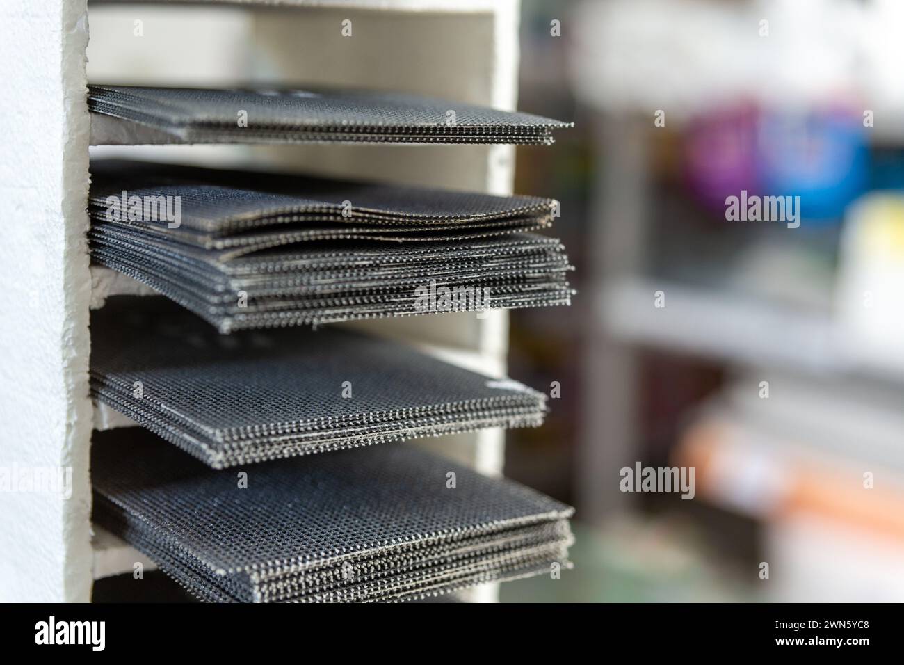A grinding grid of various grain sizes on the window of a building ...