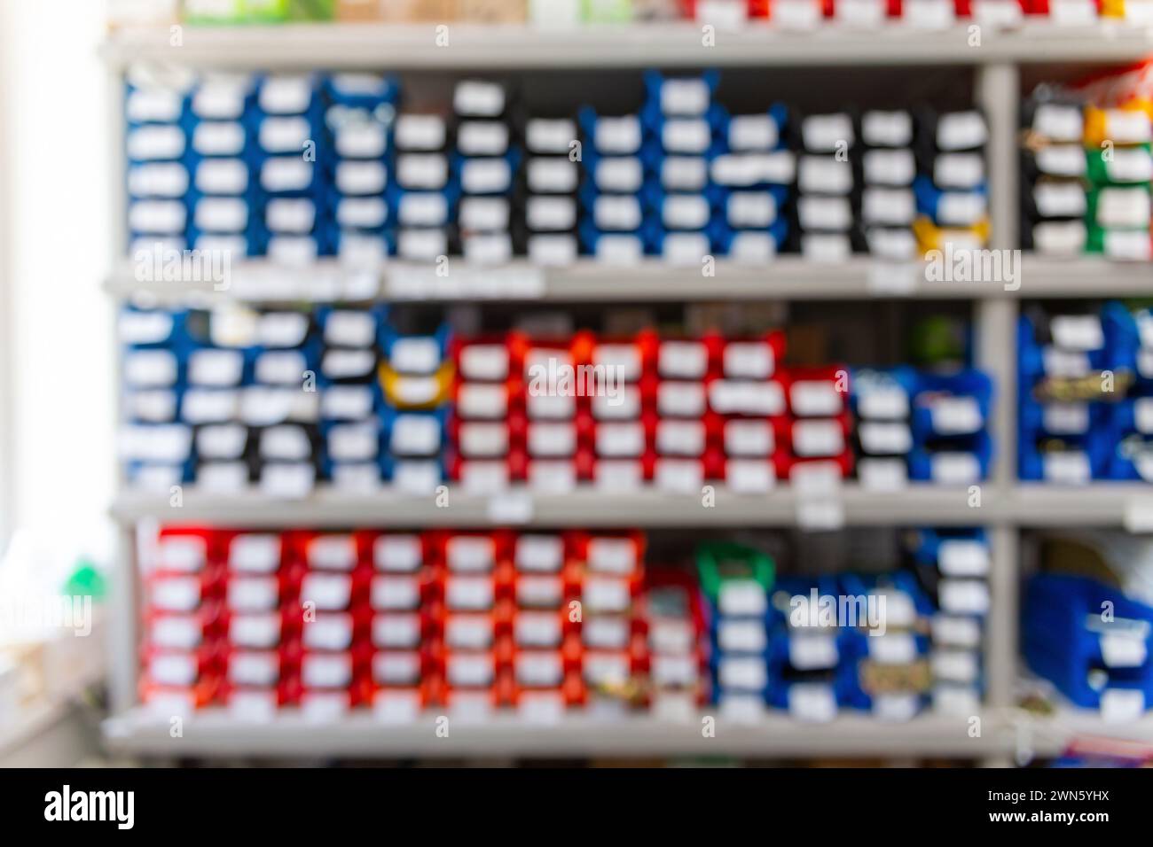 Blurred background with shelves with a large number of trays with ...
