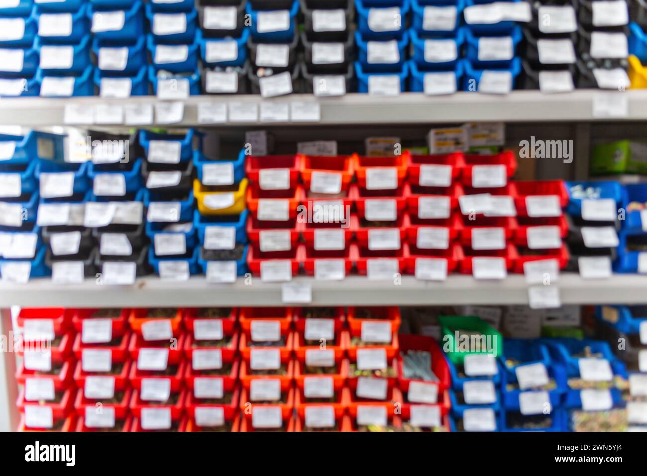 Blurred background with shelves with a large number of trays with ...