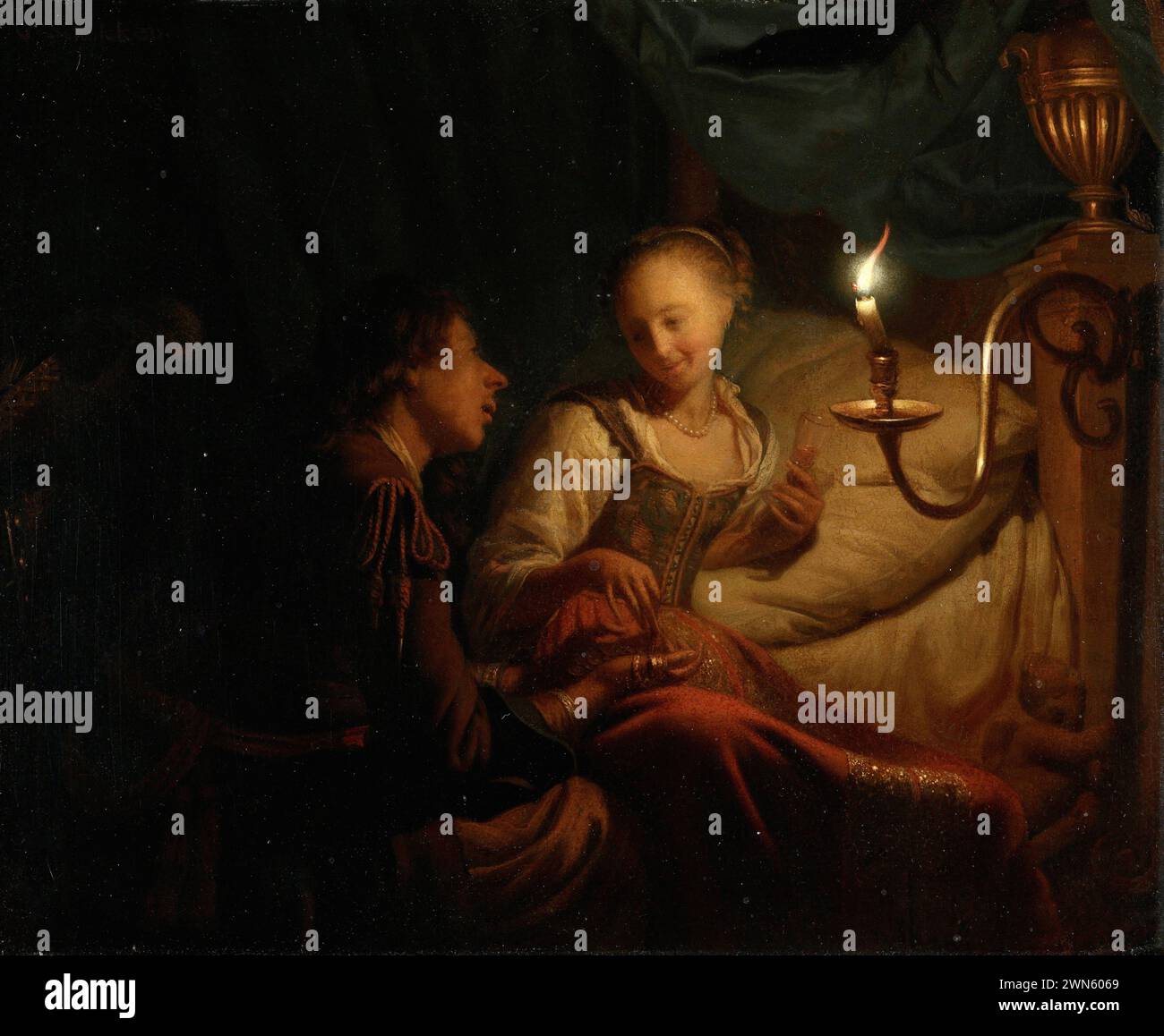 Schalcken Godfried - A Candlelight Scene; A Man offering a Gold Chain ...