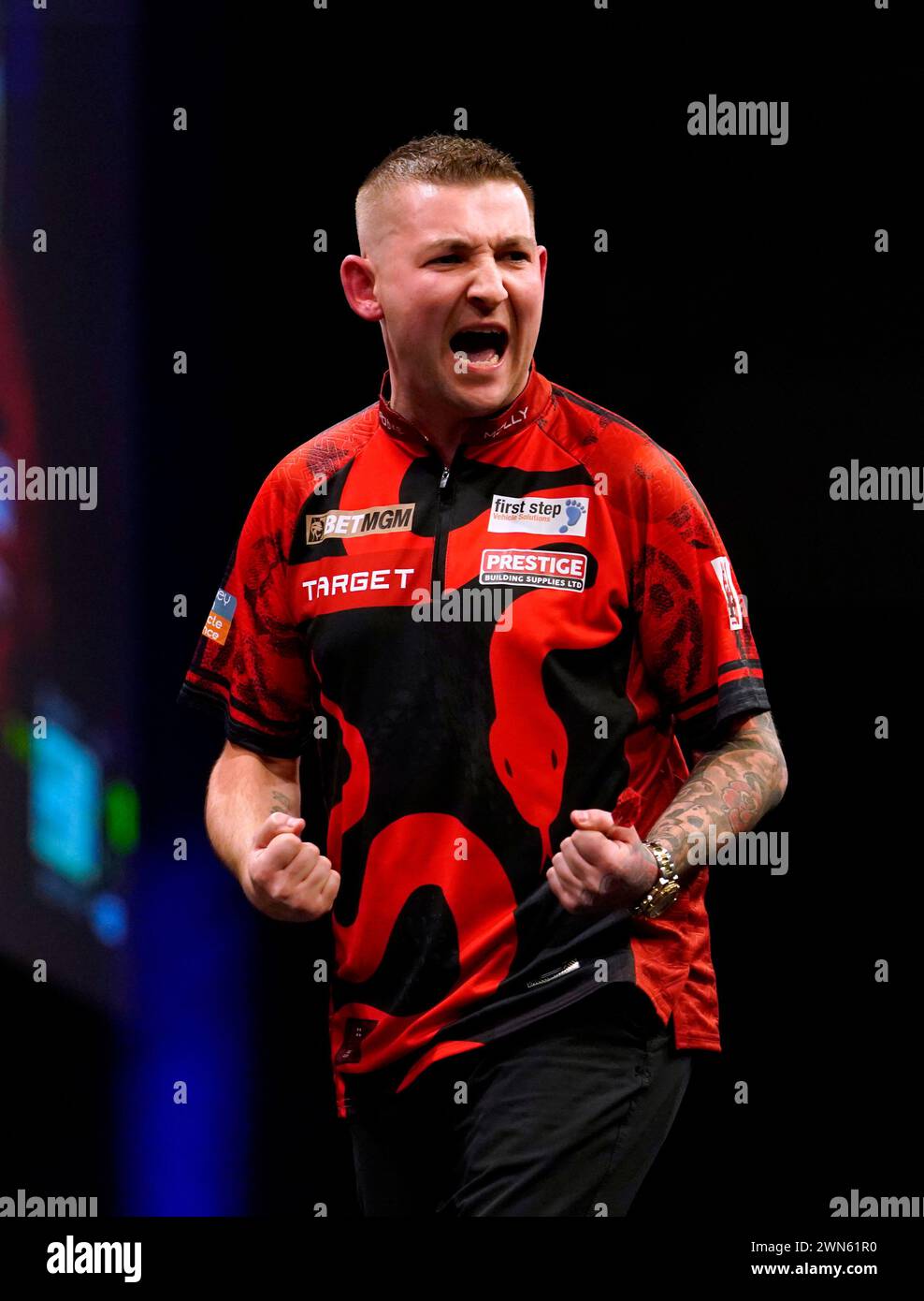 Nathan Aspinall celebrates during his match against Peter Wright (not ...