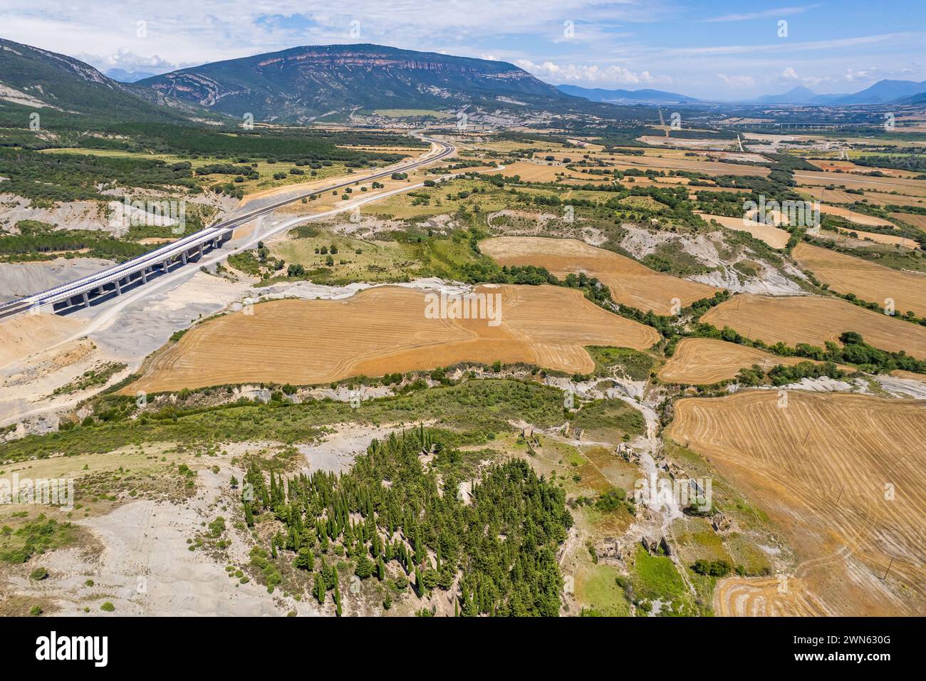 Aerial view of highway A-21 built by ruins of village of Escó by Yesa ...