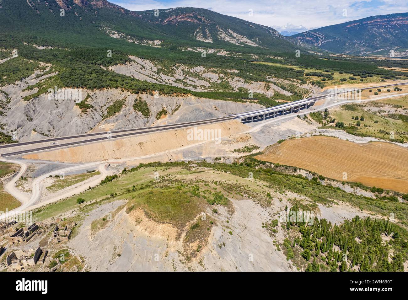 Aerial view of highway A-21 built by ruins of village of Escó by Yesa ...
