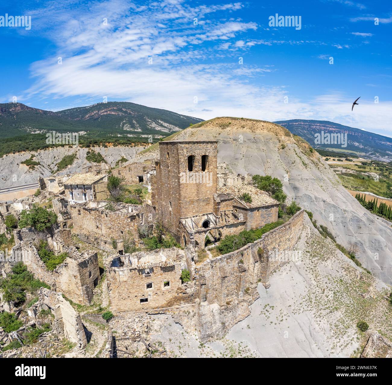Aerial view of ruins of village of Escó by Yesa reservoir in Spain ...