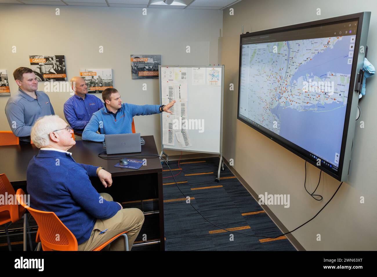 Seated in foreground is Peter A. Latta, grandson of founder of A. Duie ...