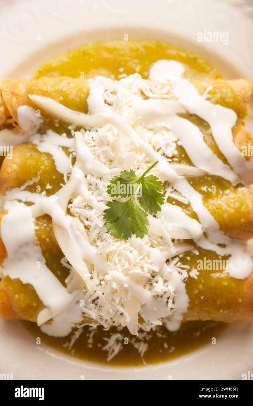 Green enchiladas. Typical Mexican dish made with a folded or rolled ...