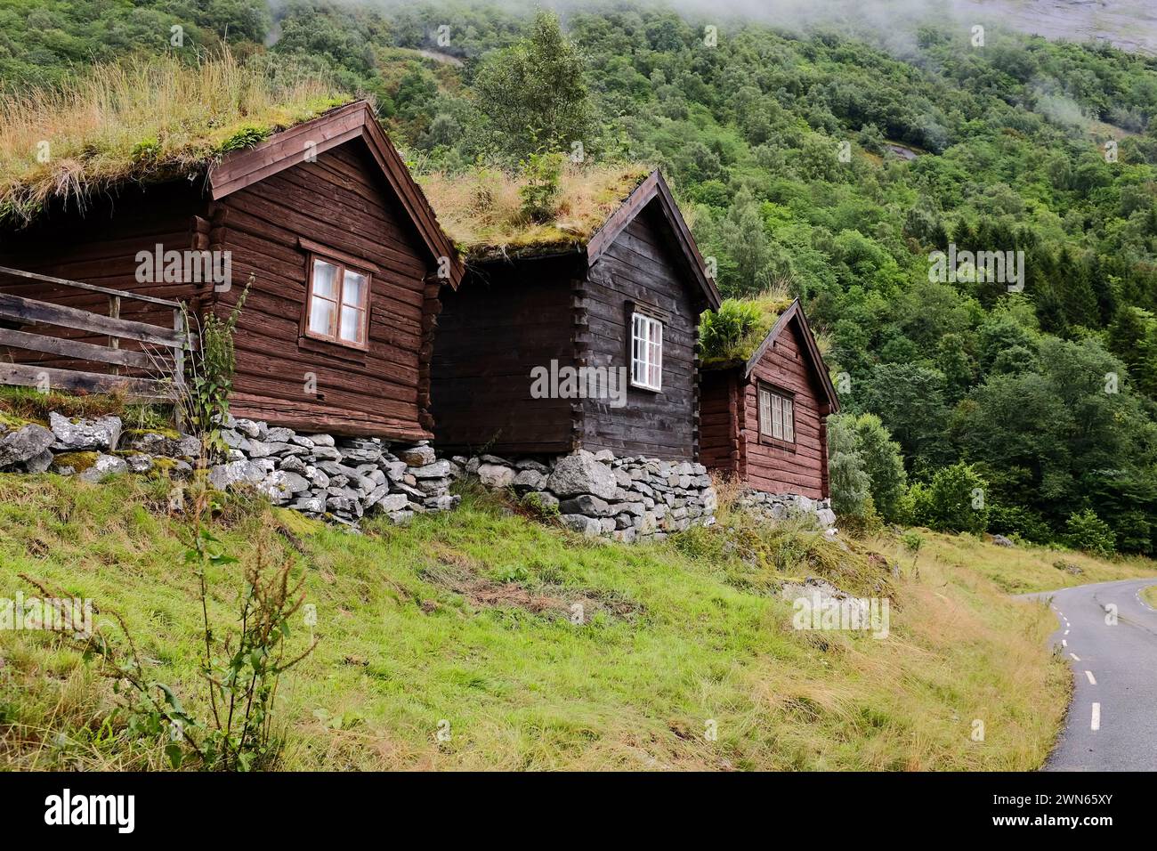 Traditional Norwegian houses made of wood, stand on foundation of ...