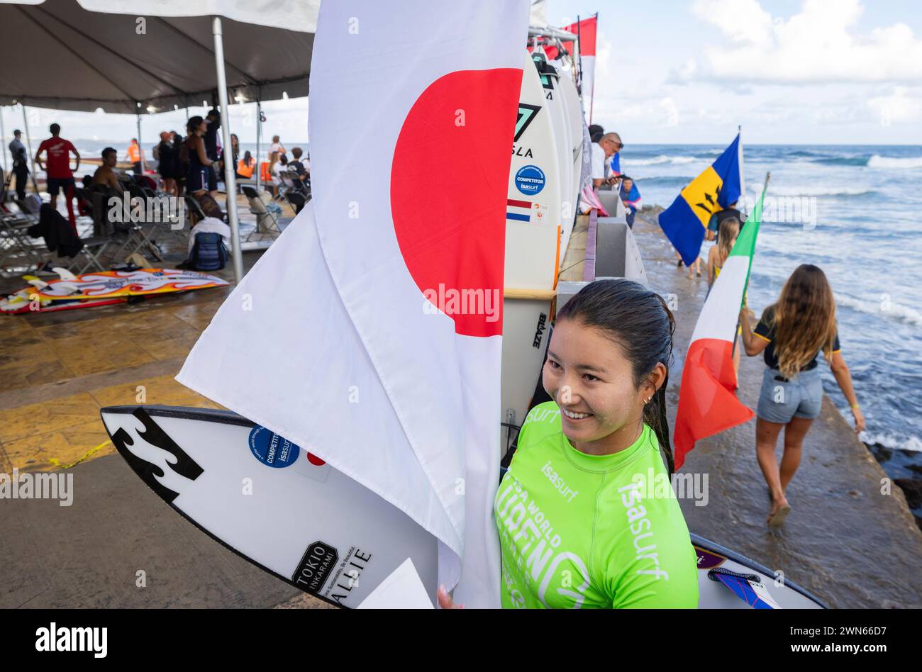 Shino Matsuda of Japan smiles after competing in the ISA World Surfing ...