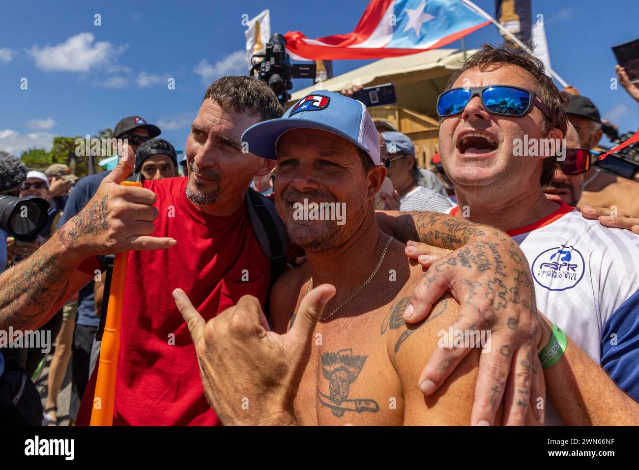 Brian Toth from Puerto Rico, center, poses for a photo with fans at the ...