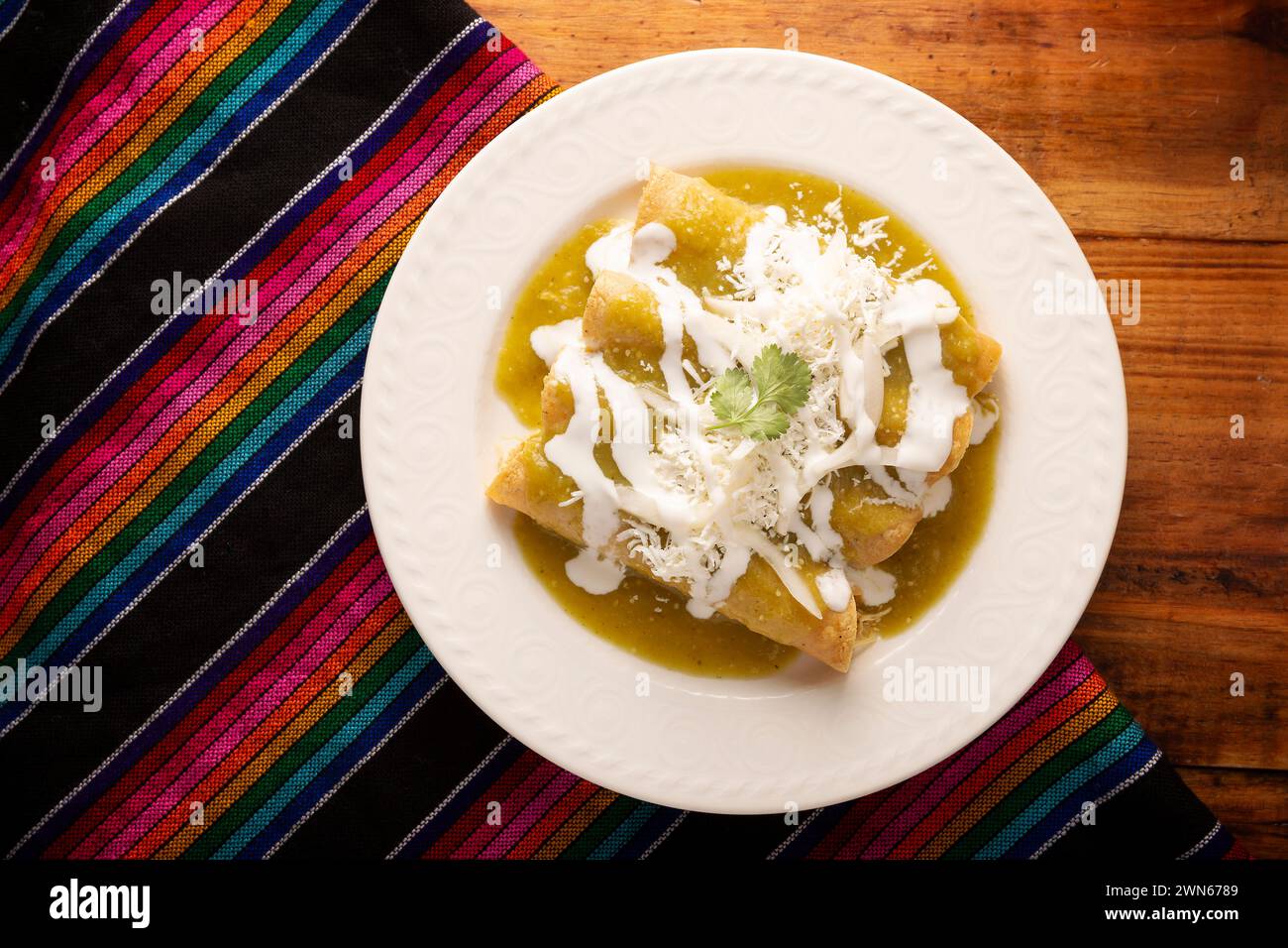 Green enchiladas. Typical Mexican dish made with a folded or rolled ...