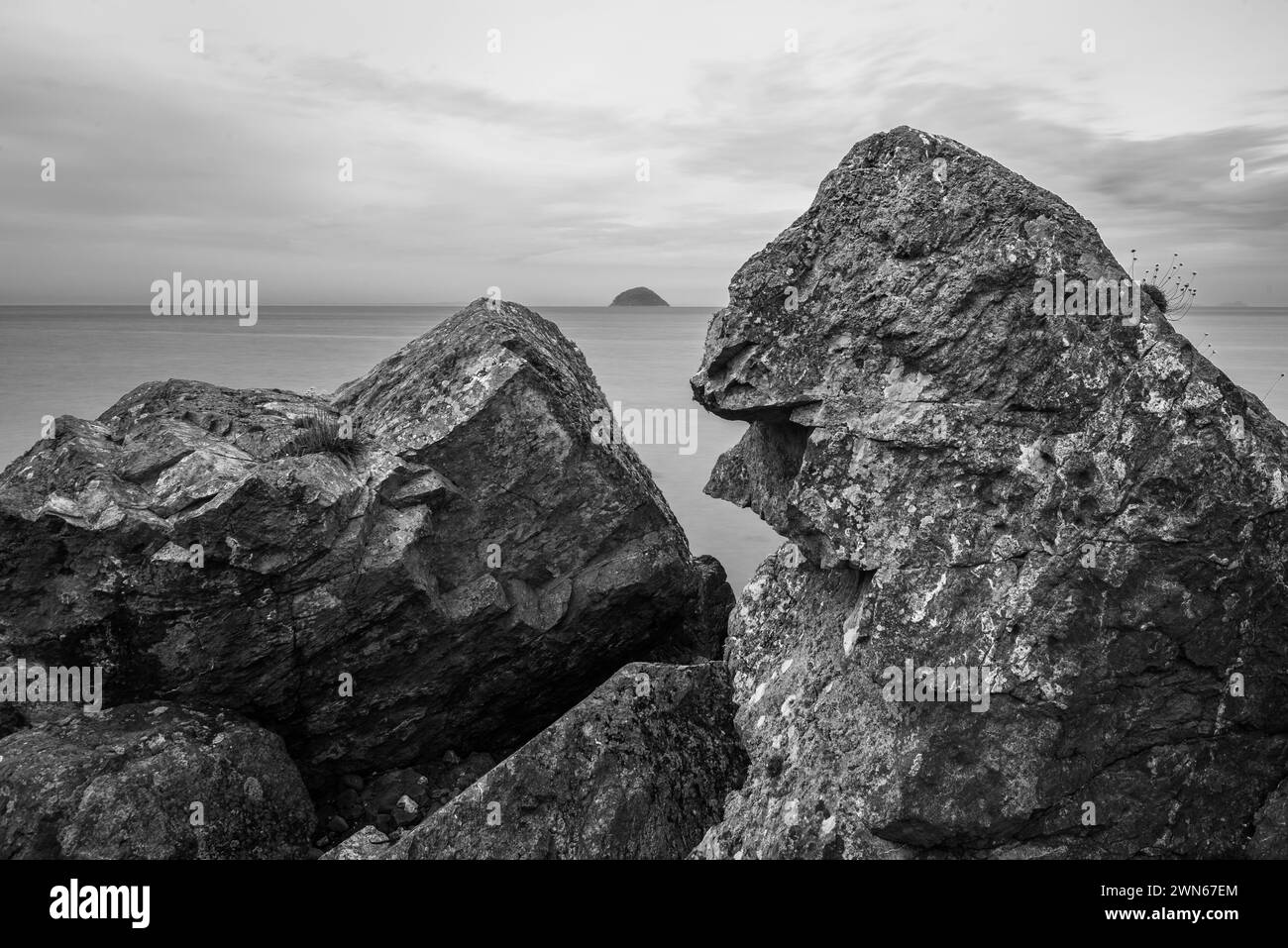 Black and white long exposure image of Ailsa Craig islandwith beach ...