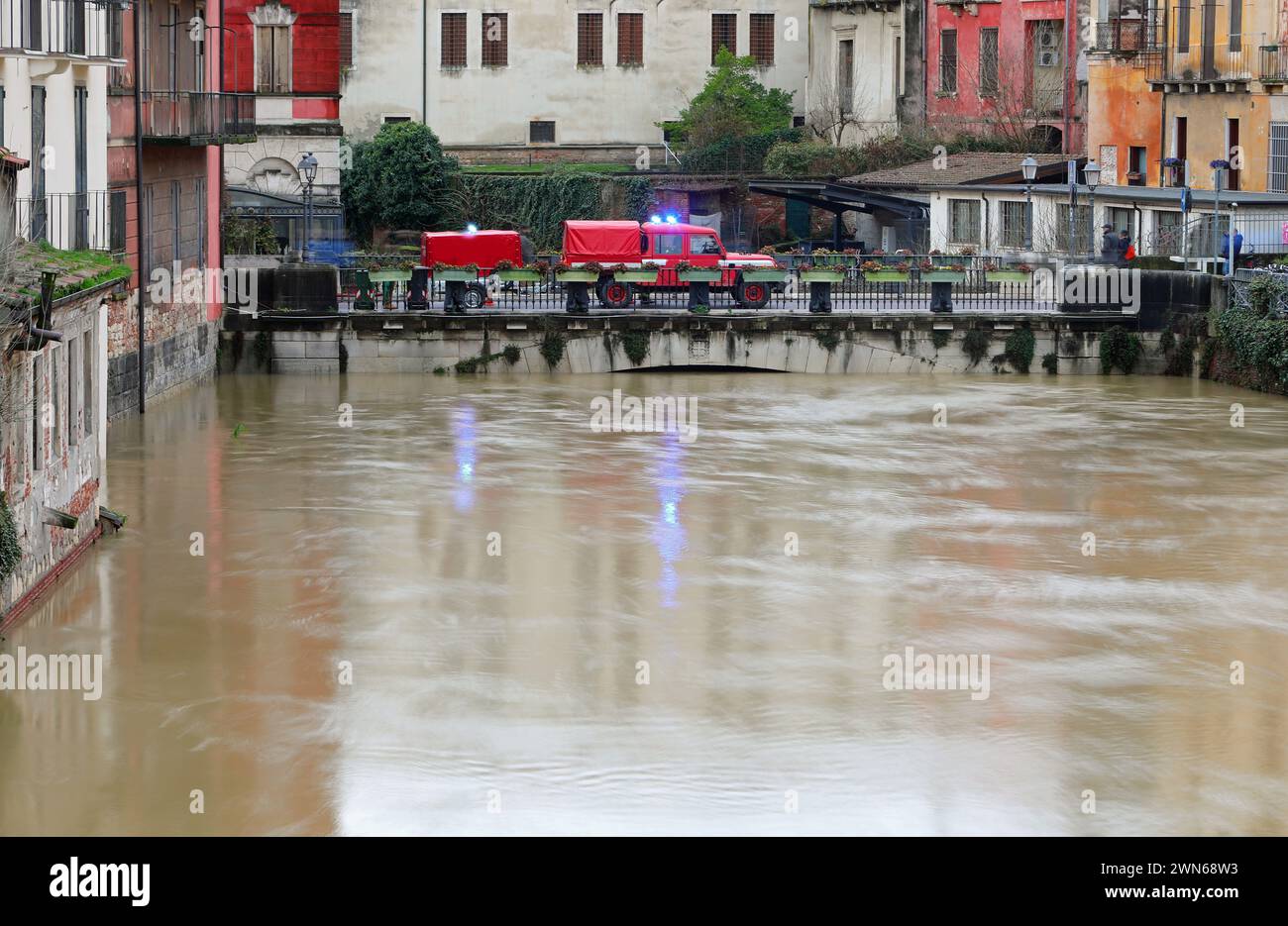 fire engines with flashing blue sirens is the river in the foothills ...