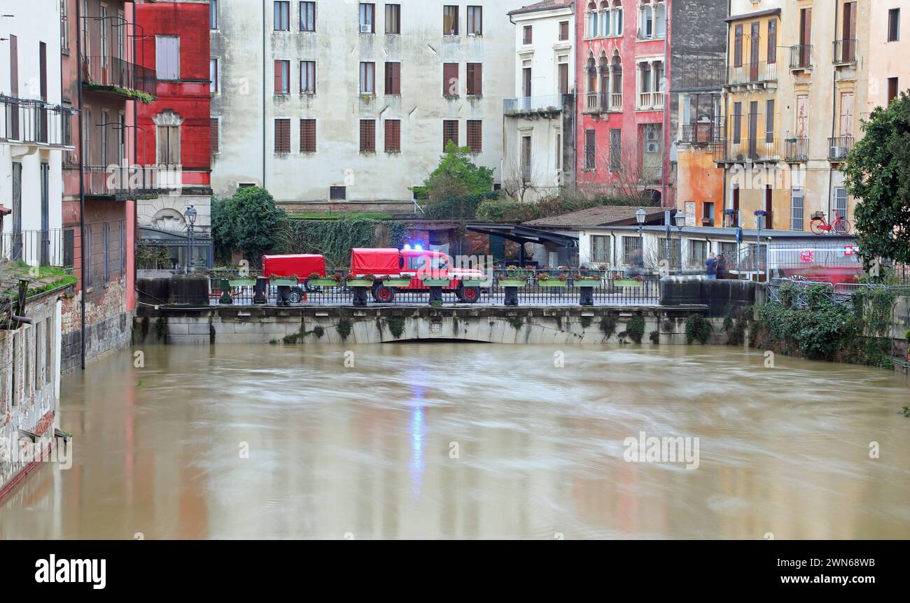 fire engines with flashing blue sirens is the river in the foothills ...