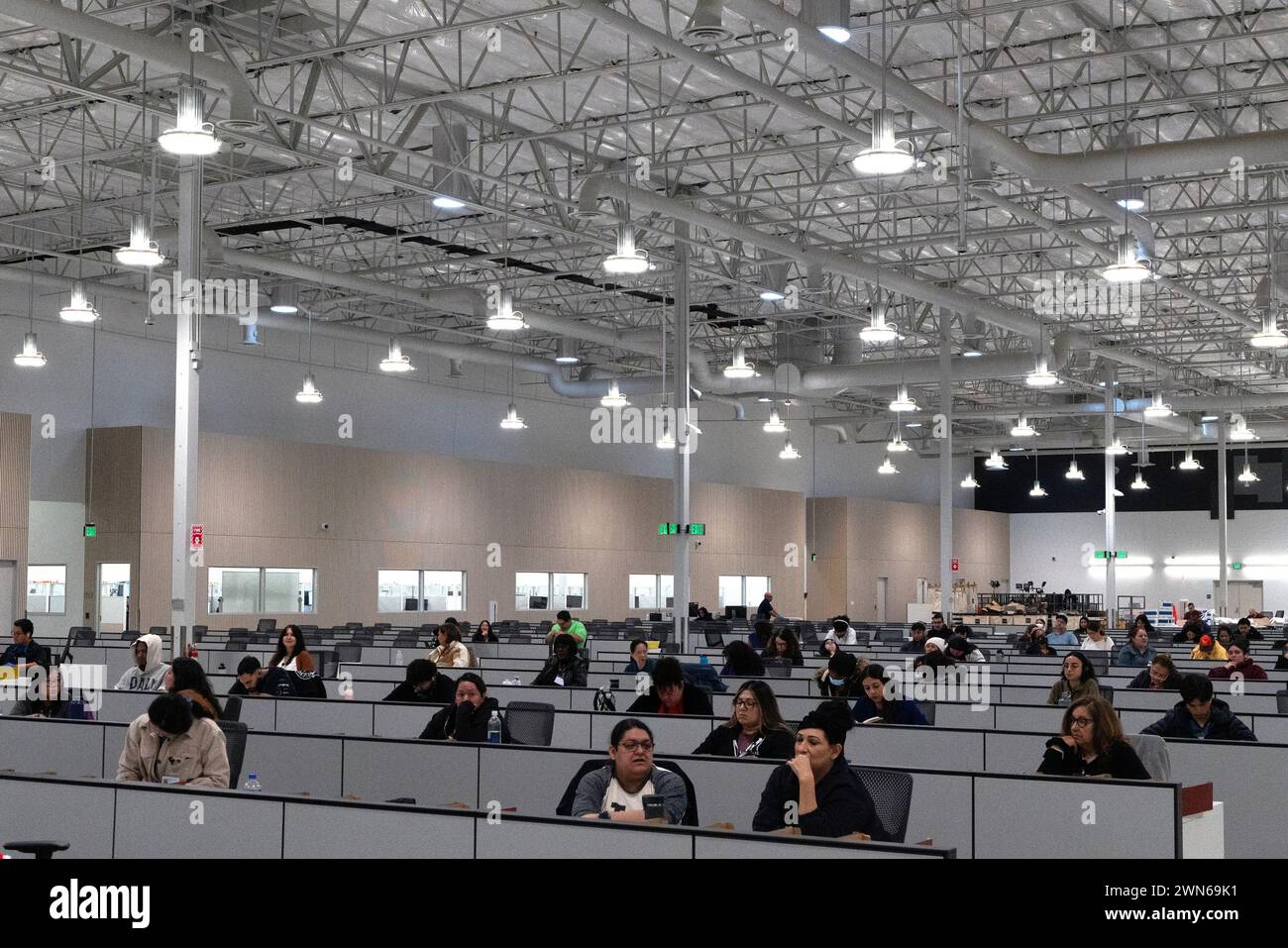 Election workers wait for ballots to check for any discrepancies at the ...
