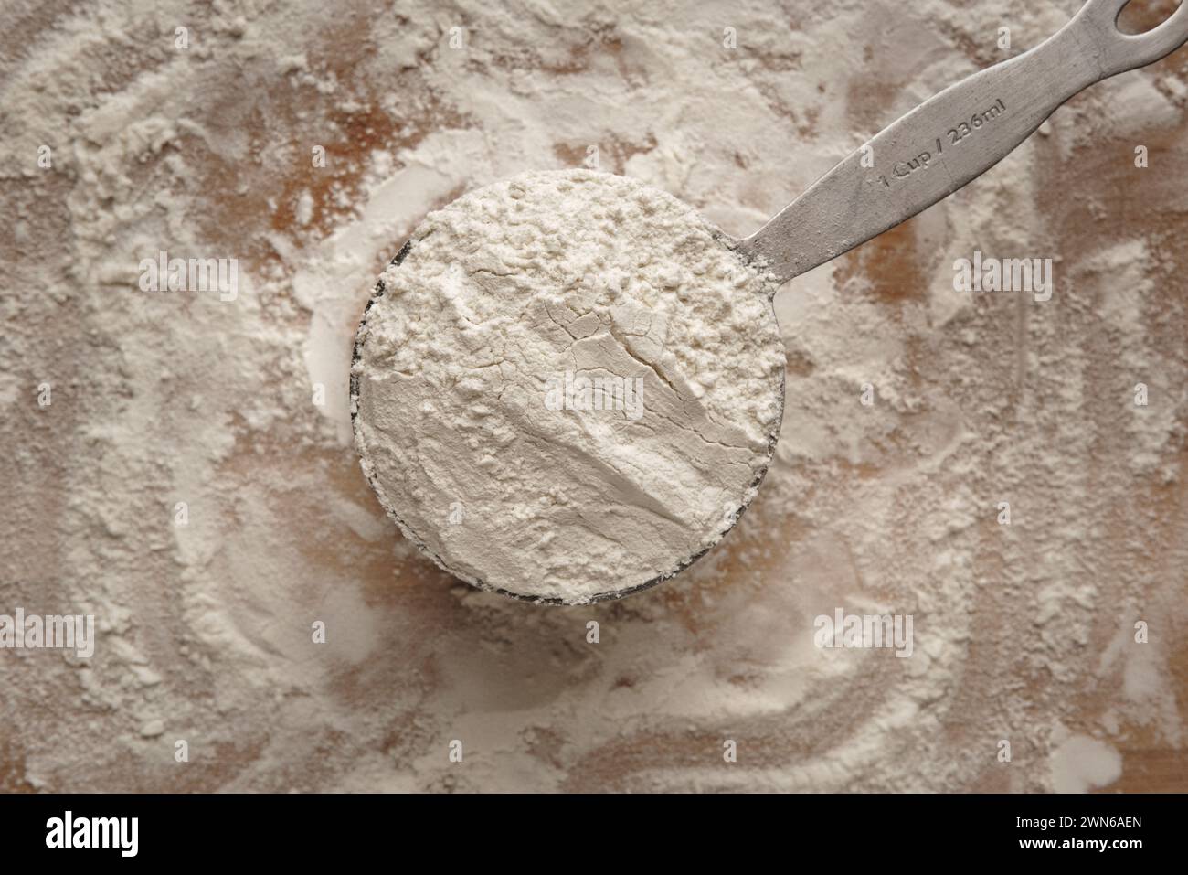 A baking utensil with flour on a flour-covered table surface Stock ...
