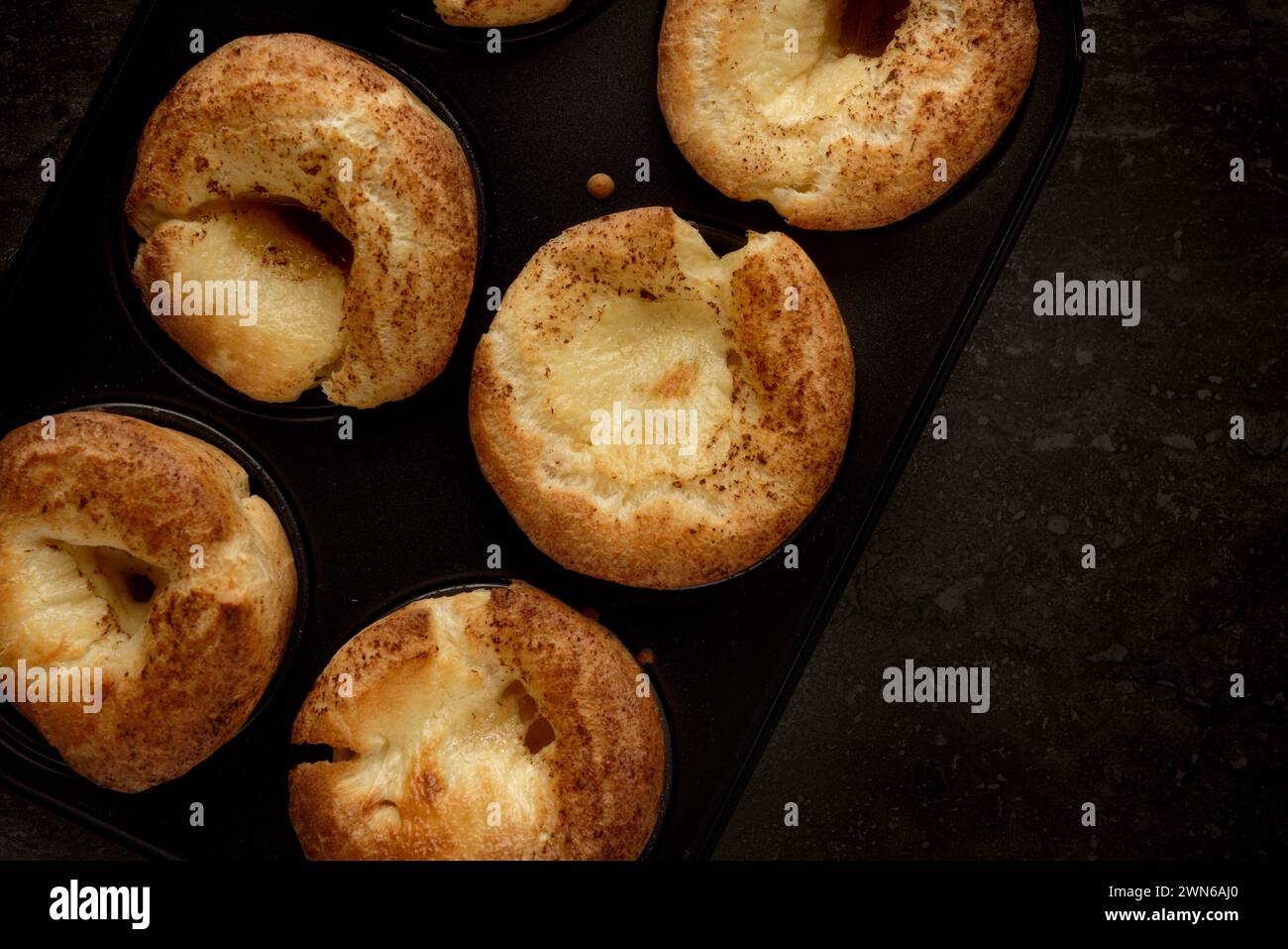 A top view of a pan filled with freshly baked Yorkshire Puddings Stock ...