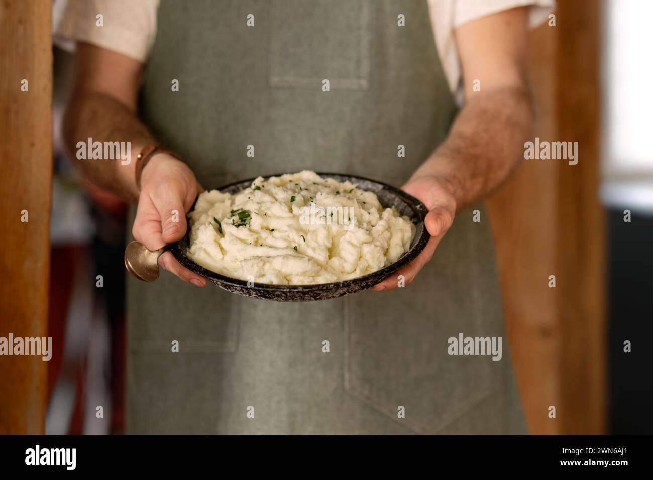 A chef showcasing a delicious mashed potato dish Stock Photo - Alamy